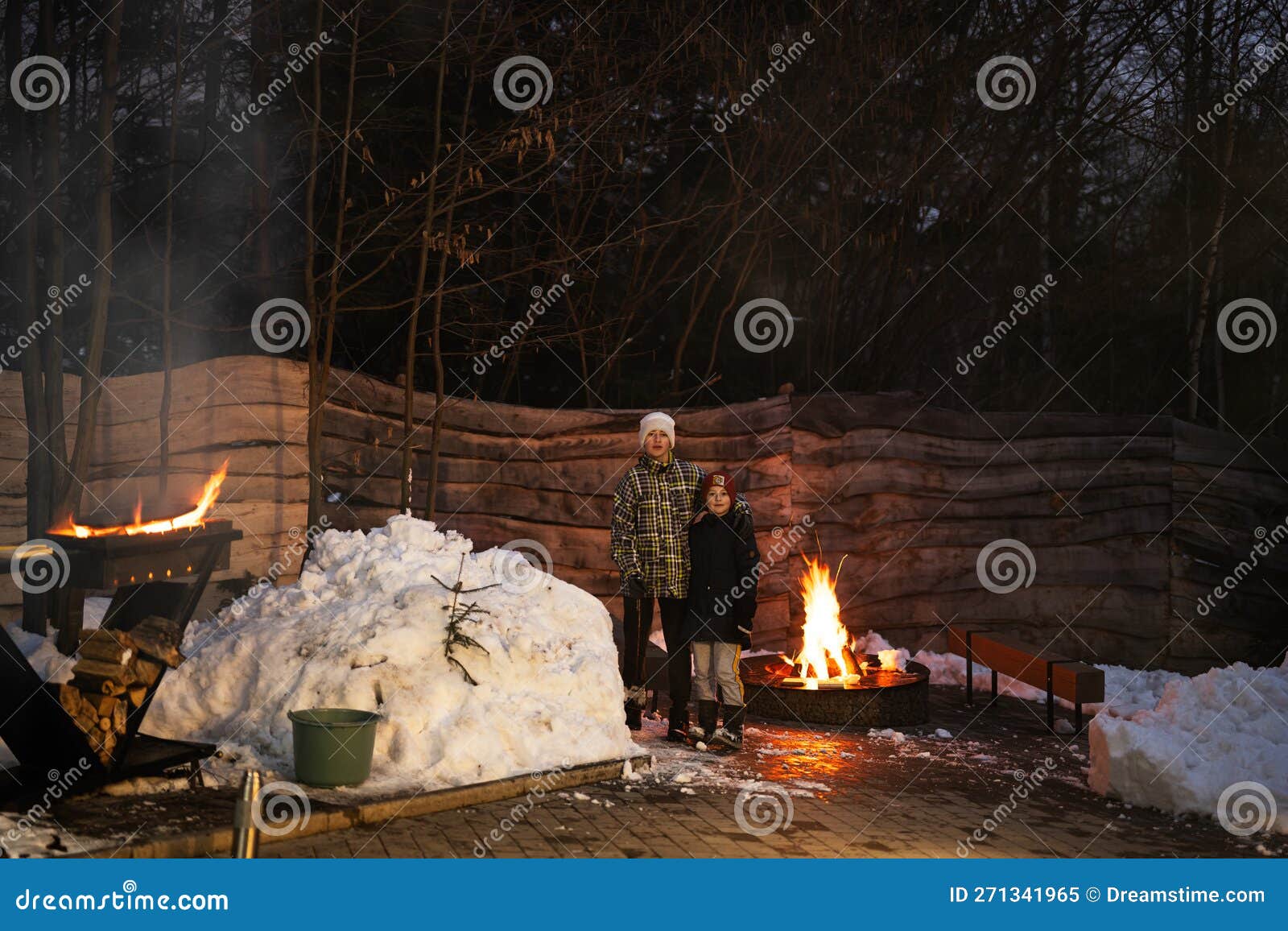 Two Brothers Stand Together by the Fire Pit in Winter Night Stock Image ...