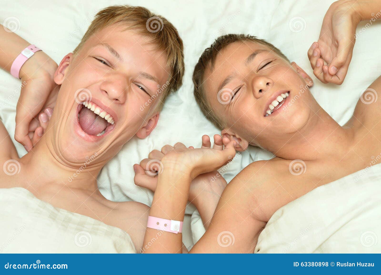 Two brothers waking up stock photo. Image of portrait - 63380898