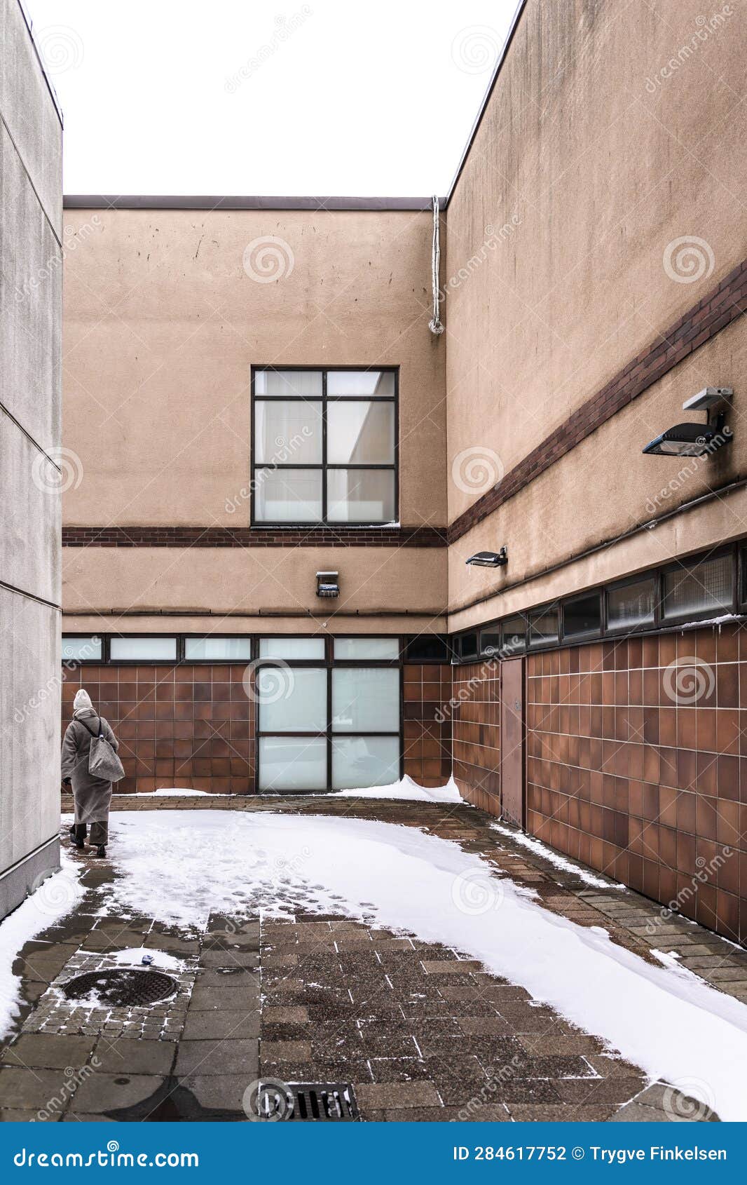 Between Two Brown Buildings on a Cold Snowy Day.. Stock Photo - Image ...