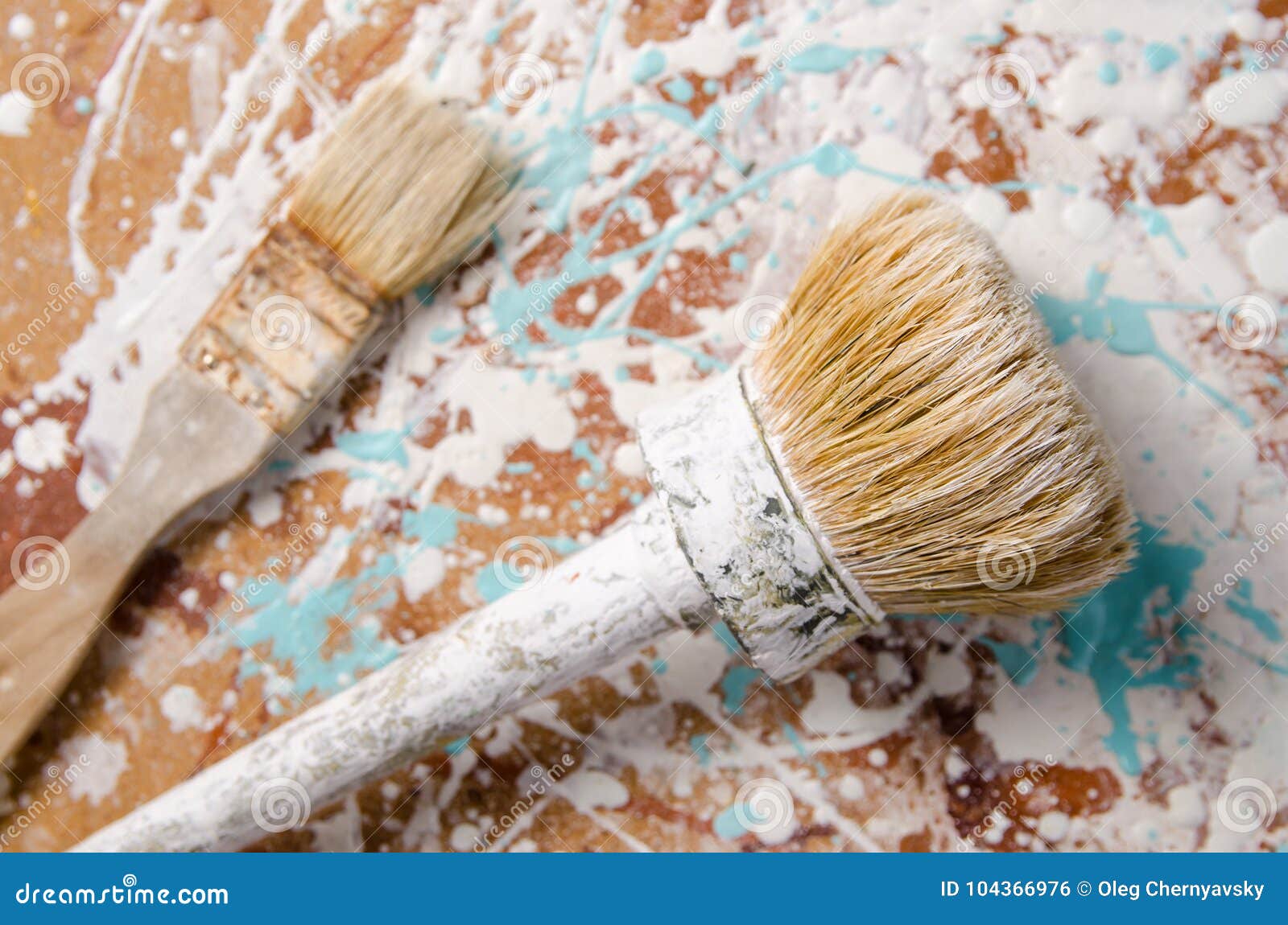 Two Brushes on a Hardboard Stained with Paint Stock Photo - Image of ...