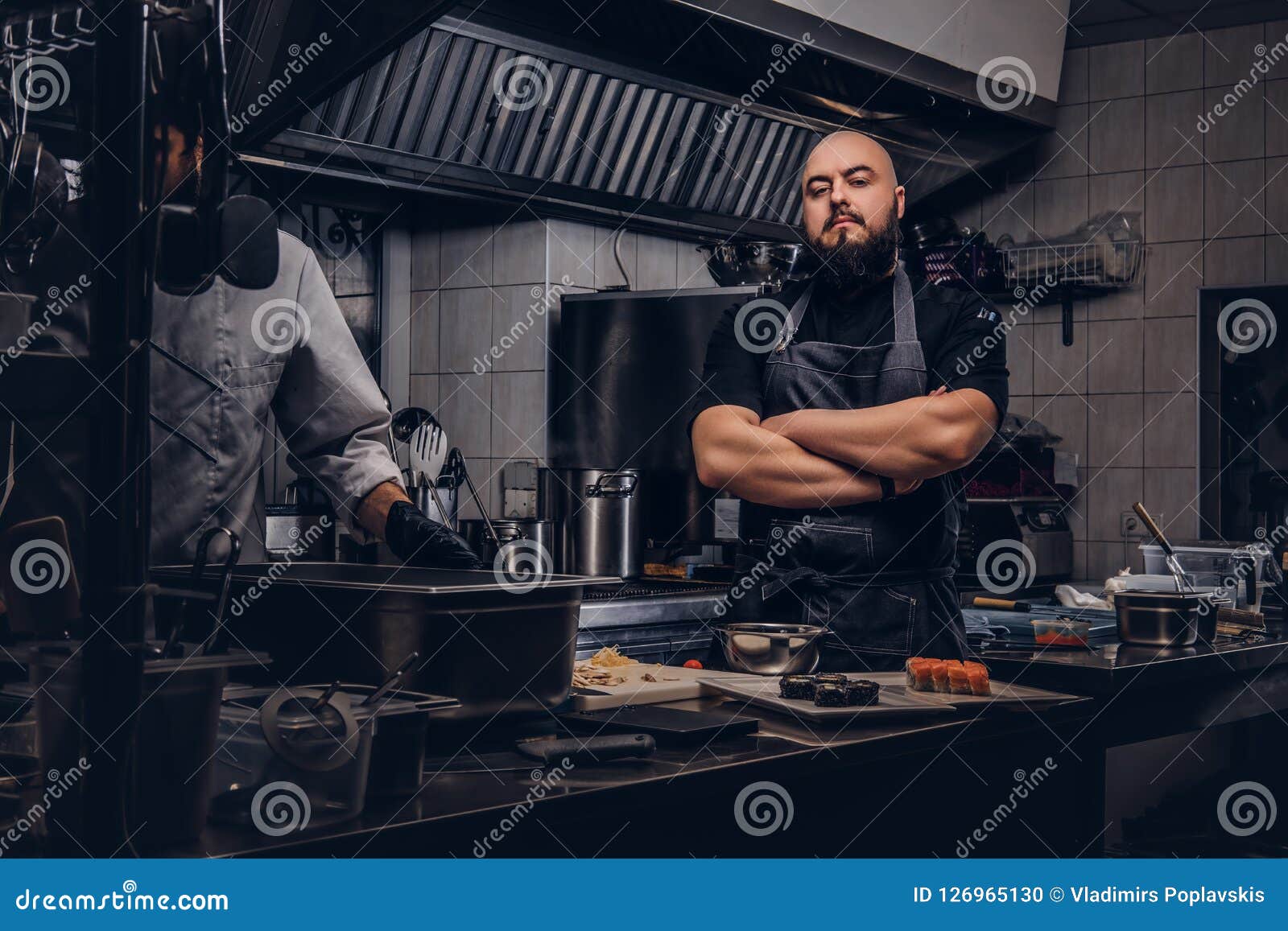 Two Brutal Cooks Dressed in Uniforms Preparing Sushi in a Kitchen ...