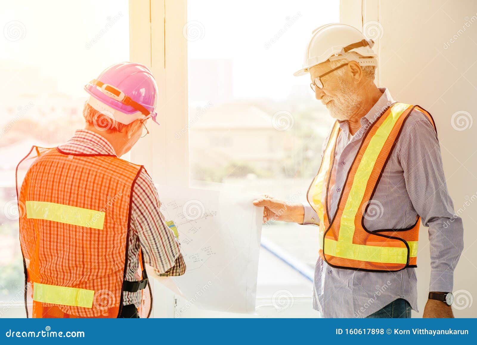 Two Builder Engineer Working Together Consulting about Building Floor ...