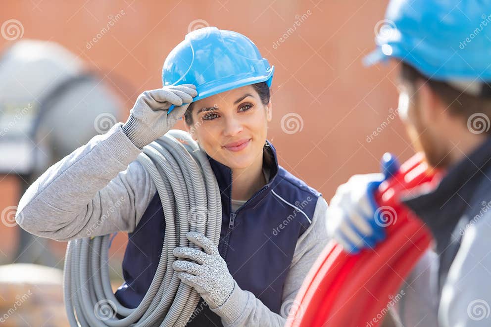 Two Builder People at Construction Site Stock Photo - Image of safety ...