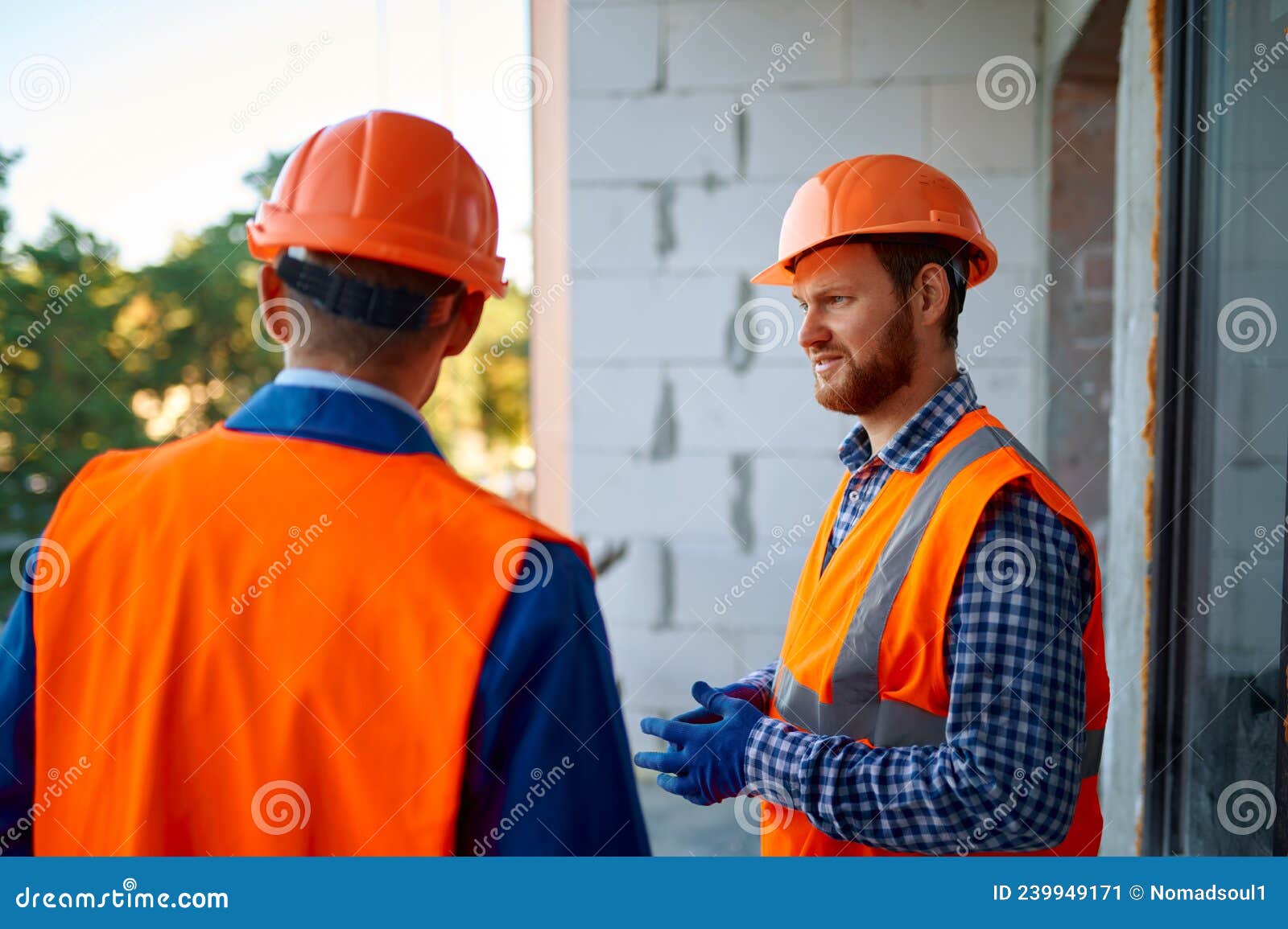 Two Builder Standing Talking at Construction Site Stock Image - Image ...
