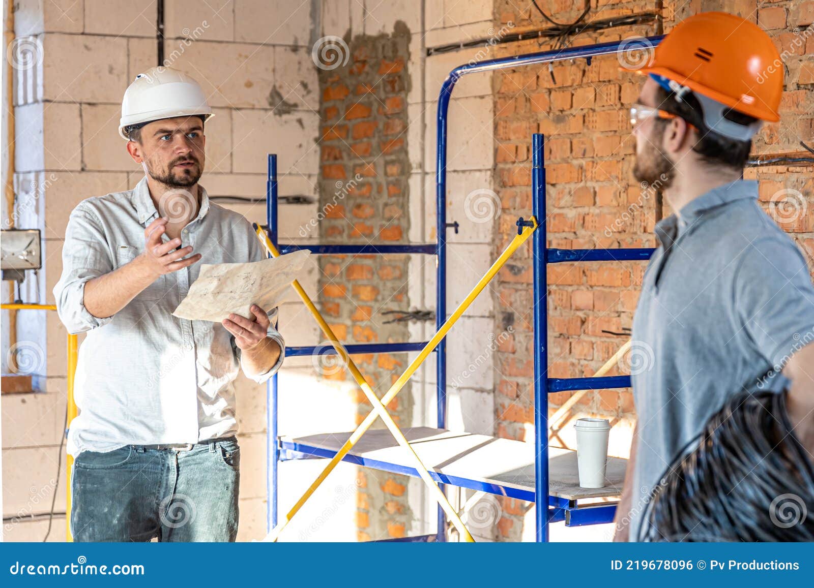 Two Builders Collaborate To Build a New Home Stock Photo - Image of ...