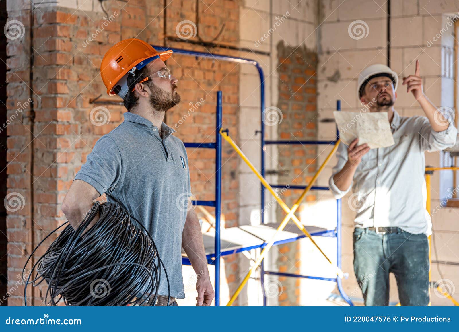 Two Builders Collaborate To Build a New Home Stock Photo - Image of ...