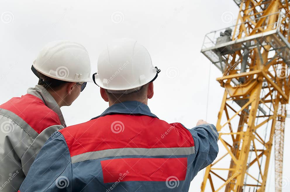 Two Builders at Construction Site Stock Photo - Image of building ...