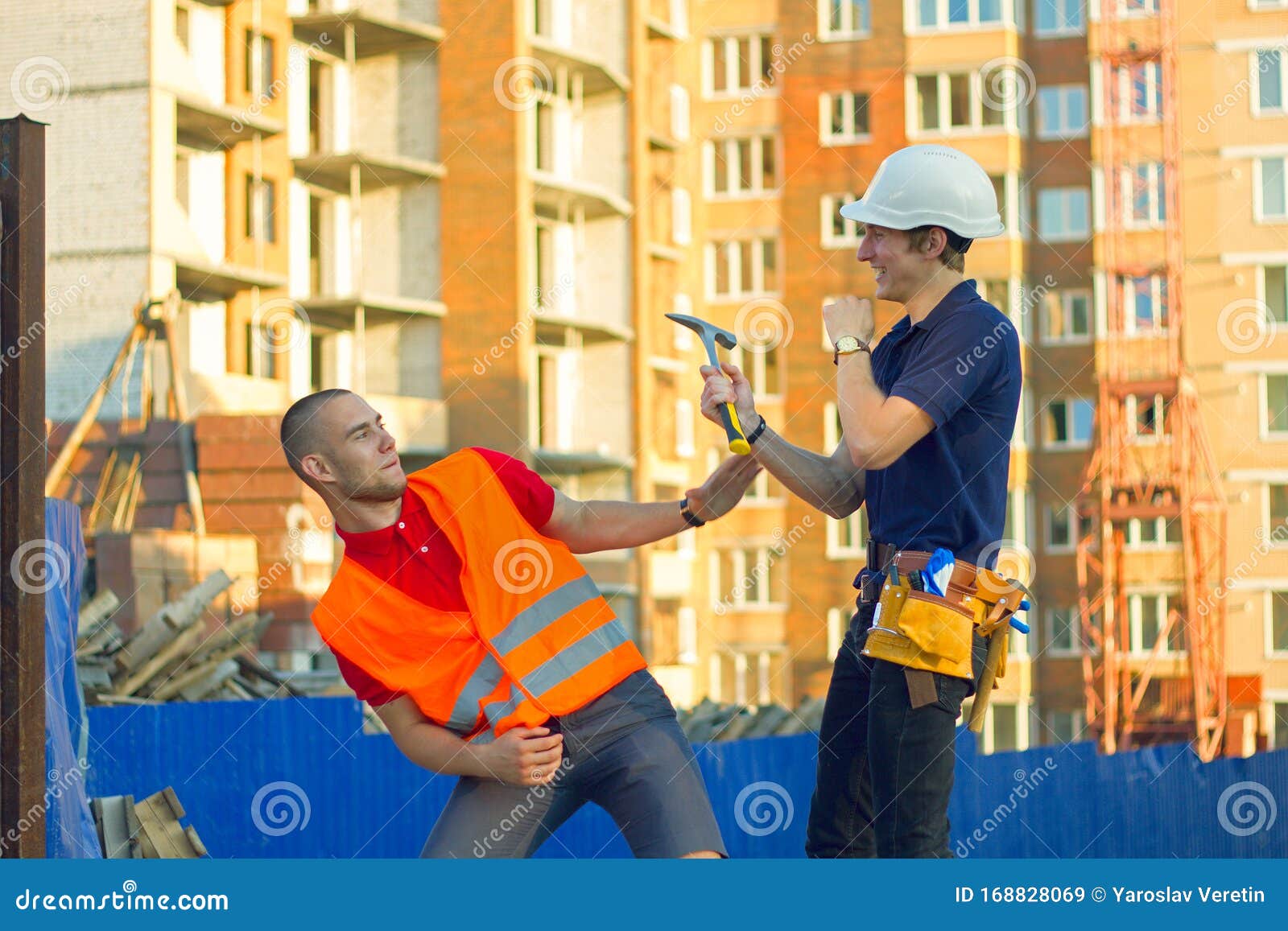 Two Builders at Construction Site Fooling Around Stock Image - Image of ...