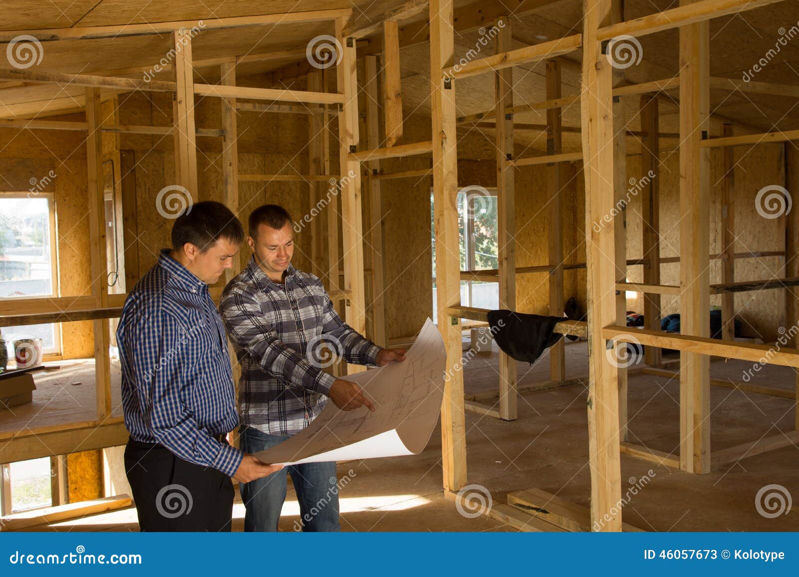 Two Builders Discussing the Interior of a House Stock Image - Image of ...