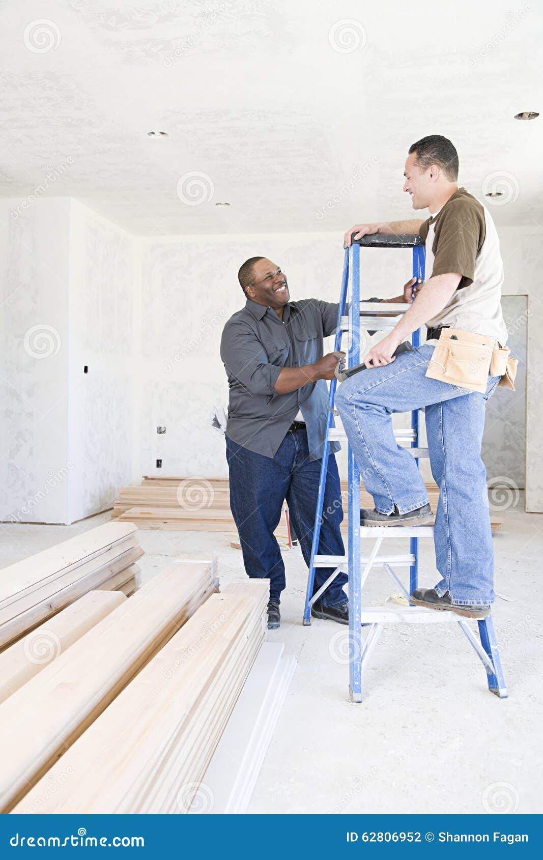 Two builders talking stock photo. Image of contractor - 62806952