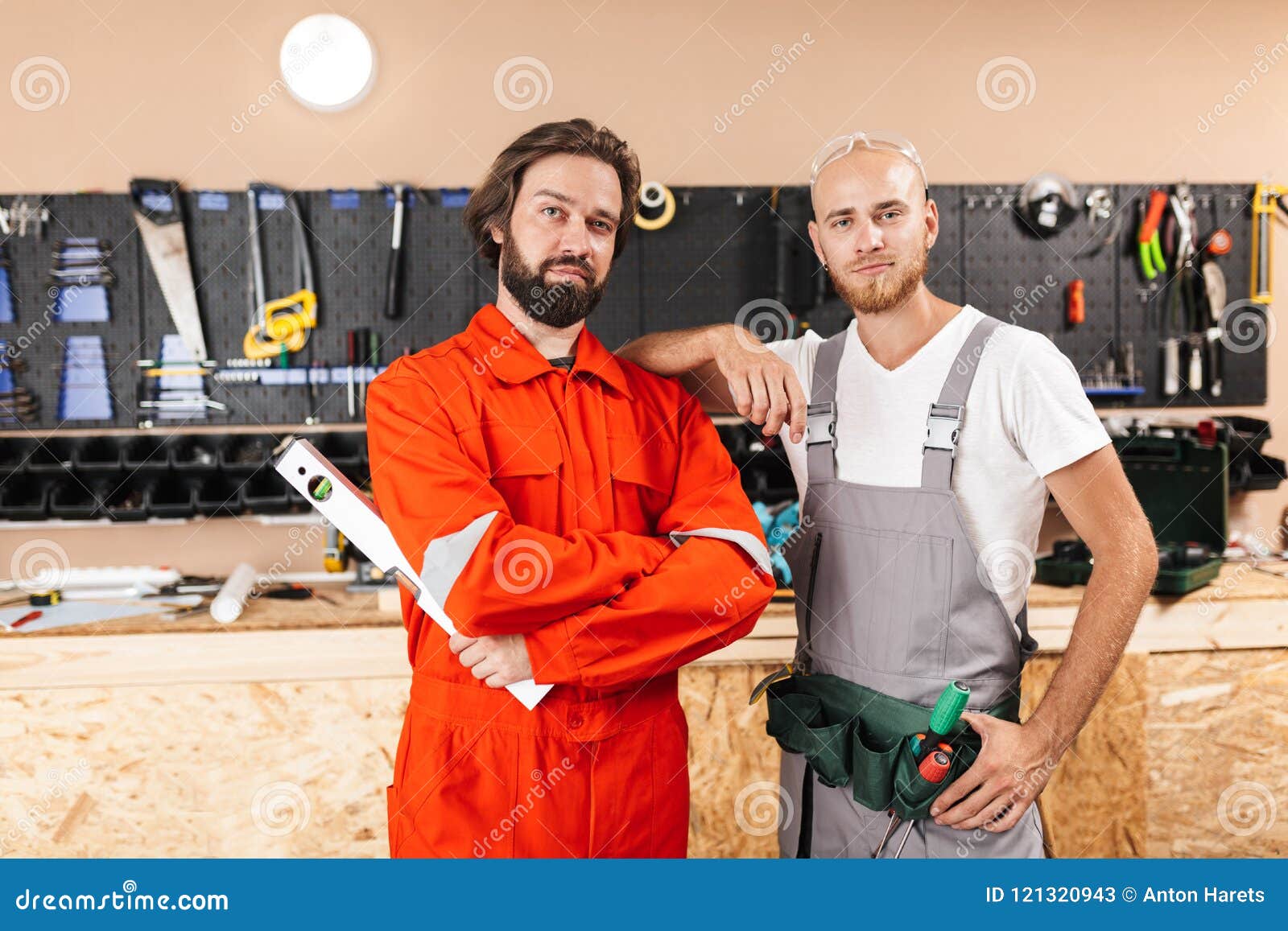 Two Builders in Work Clothes Thoughtfully Looking in Camera Spen Stock ...