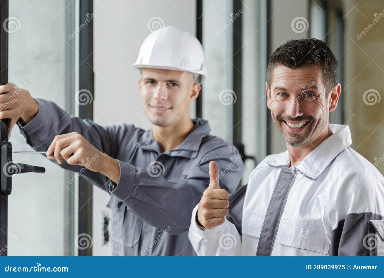 Two Builders Working Indoors Stock Image - Image of gadgets, working ...