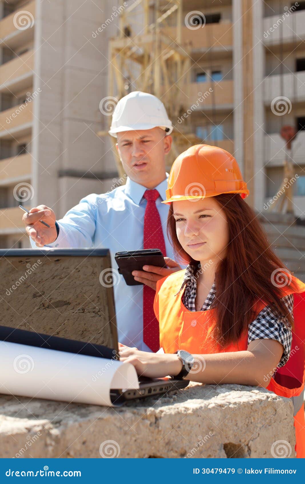Two Builders Works on the Building Site Stock Image - Image of ...