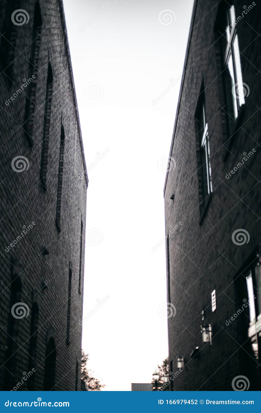 Two Buildings with a Bright Sky Stock Photo - Image of parallel ...