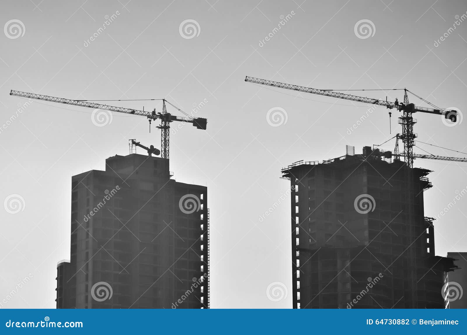 Two buildings and cranes stock photo. Image of workplace - 64730882