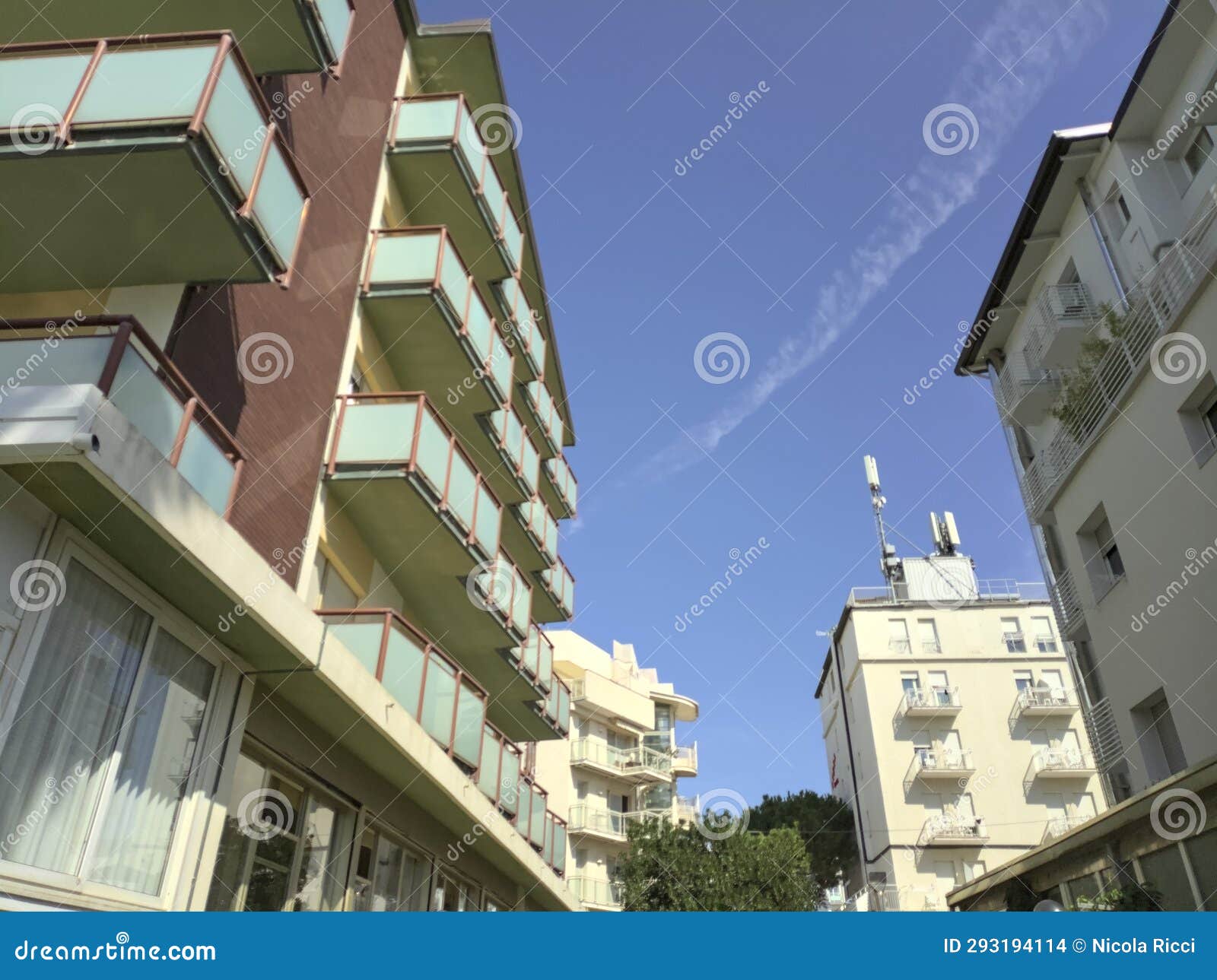 Two Buildings Side by Side with Balconies by Their Sides on a Sunny Day ...