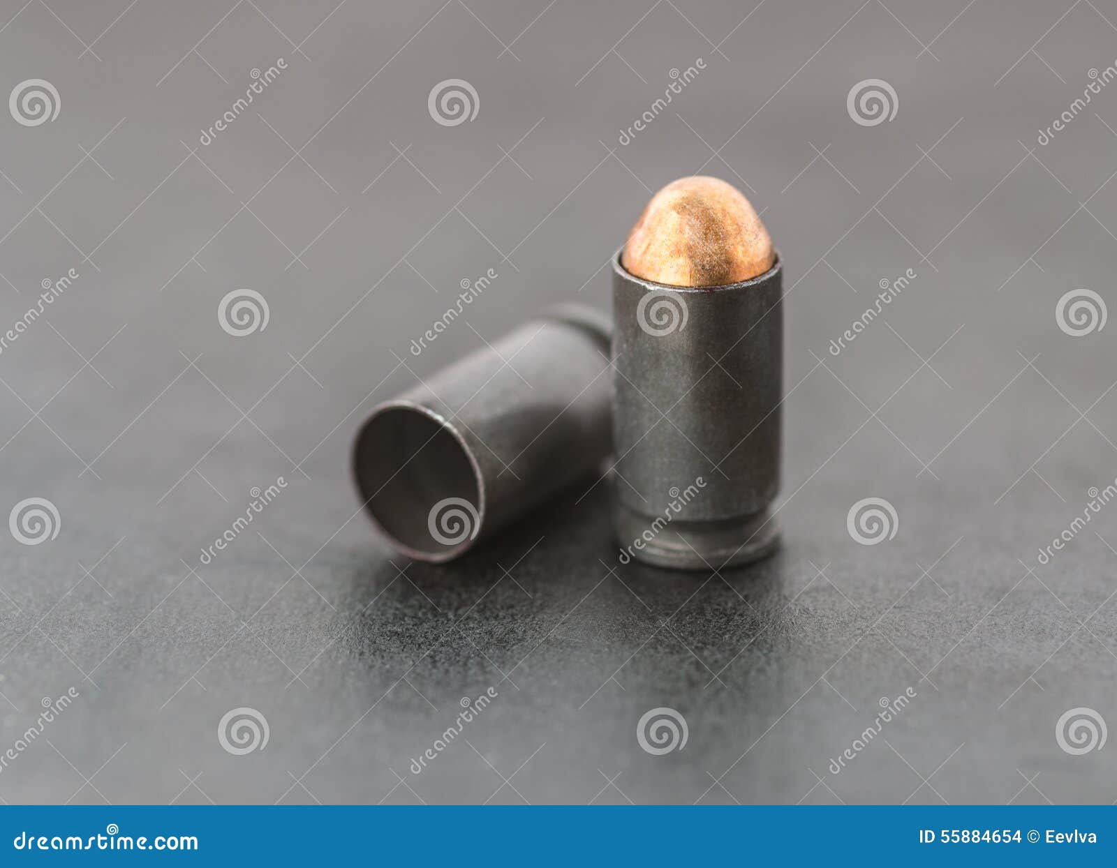 Two bullets. stock photo. Image of dirt, military, background - 55884654