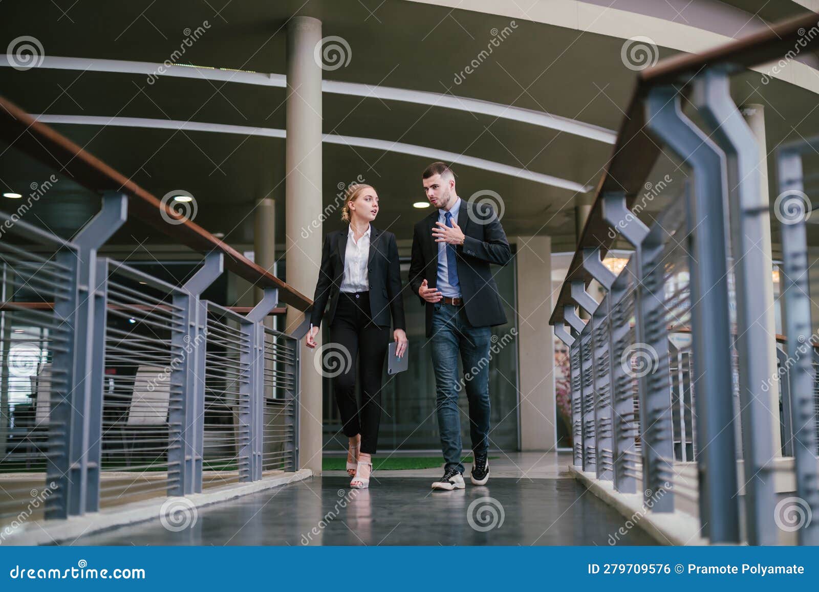 Two Business Colleagues Having Discussion with Using a Digital Tablet ...