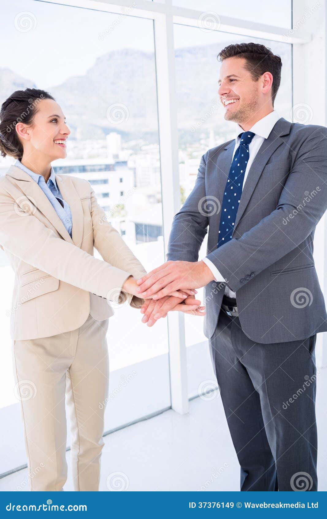 Two Business Colleagues Joining Hands Together Stock Image - Image of ...