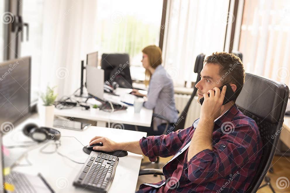 Making a Phone Call at Work Stock Image - Image of cooperation ...