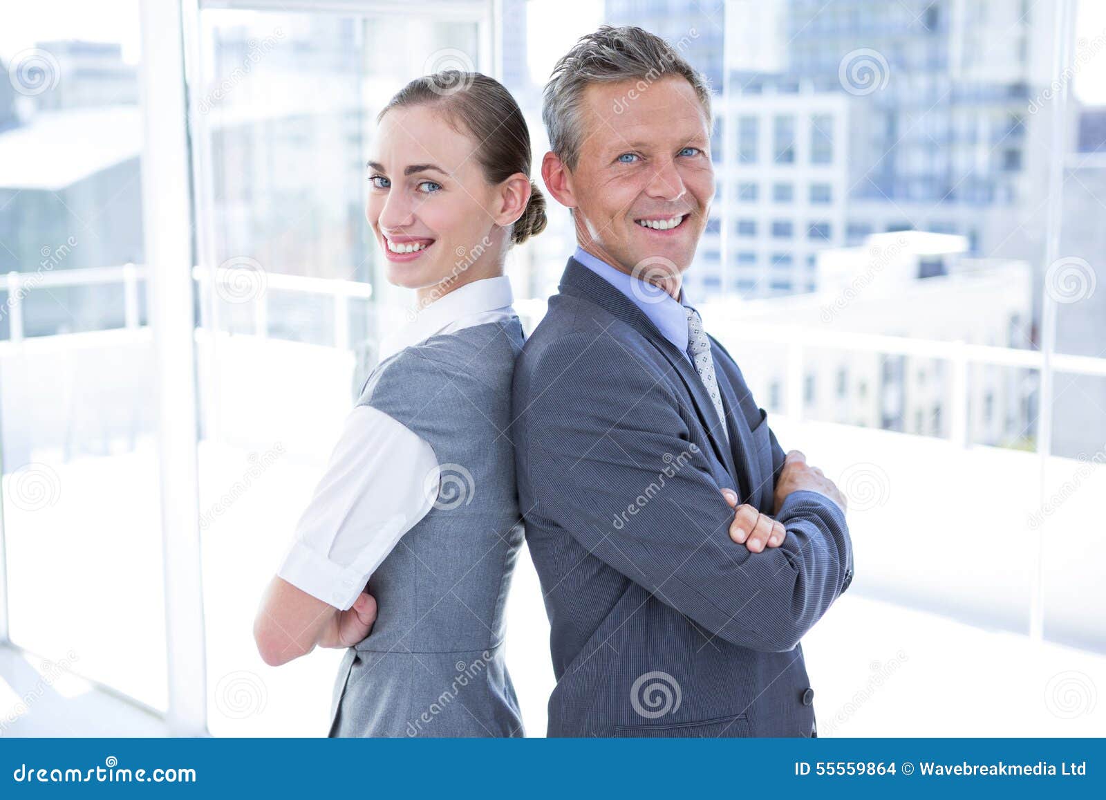 Two Business Colleagues Standing Back To Back Stock Photo - Image of ...