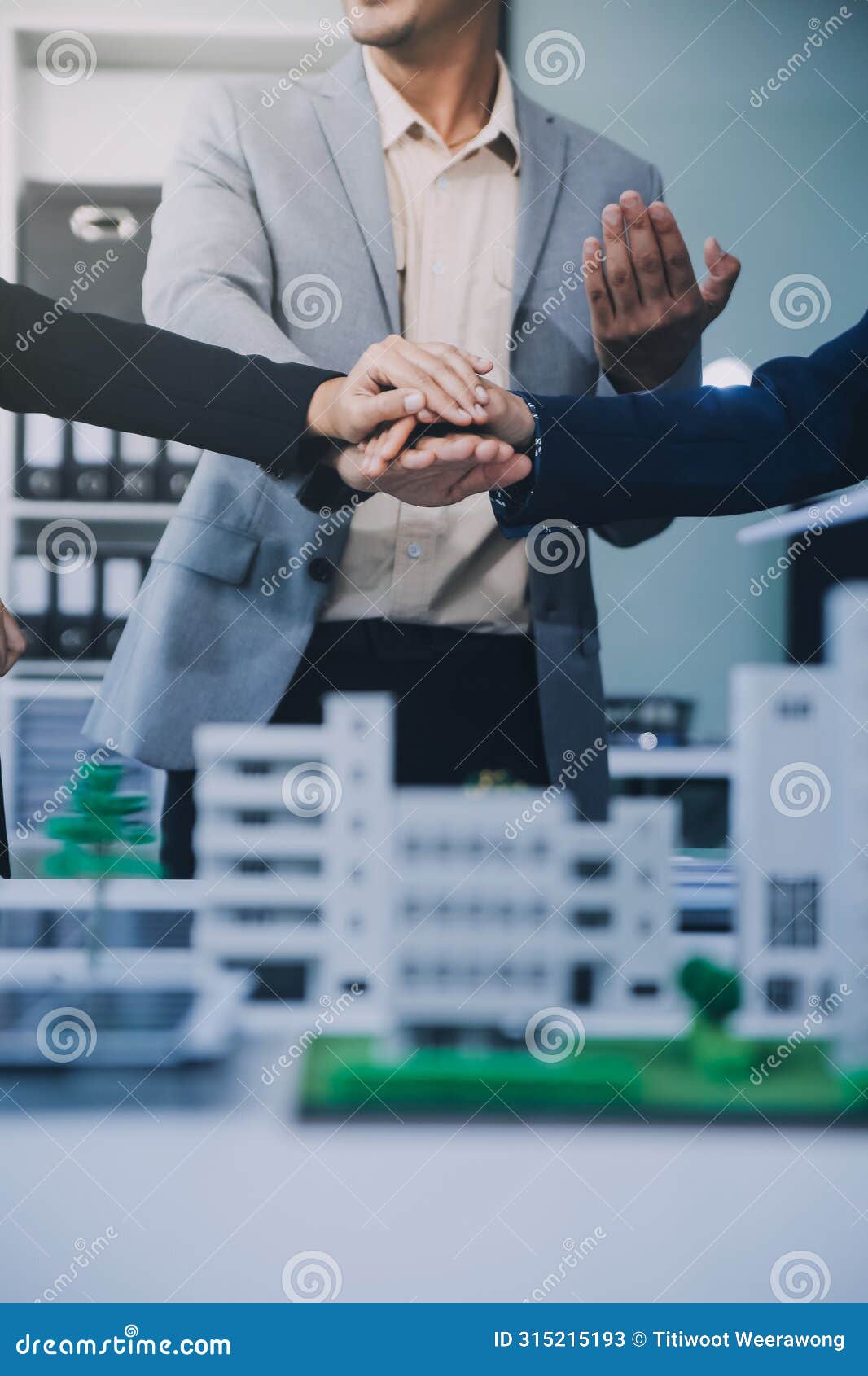 Two Business Executives, Elegantly Attired in Suits, Join Hands in a ...
