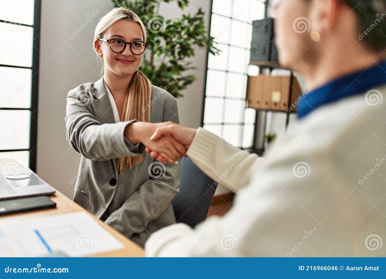 Two Business Executives Shaking Hands at the Office Stock Photo - Image ...