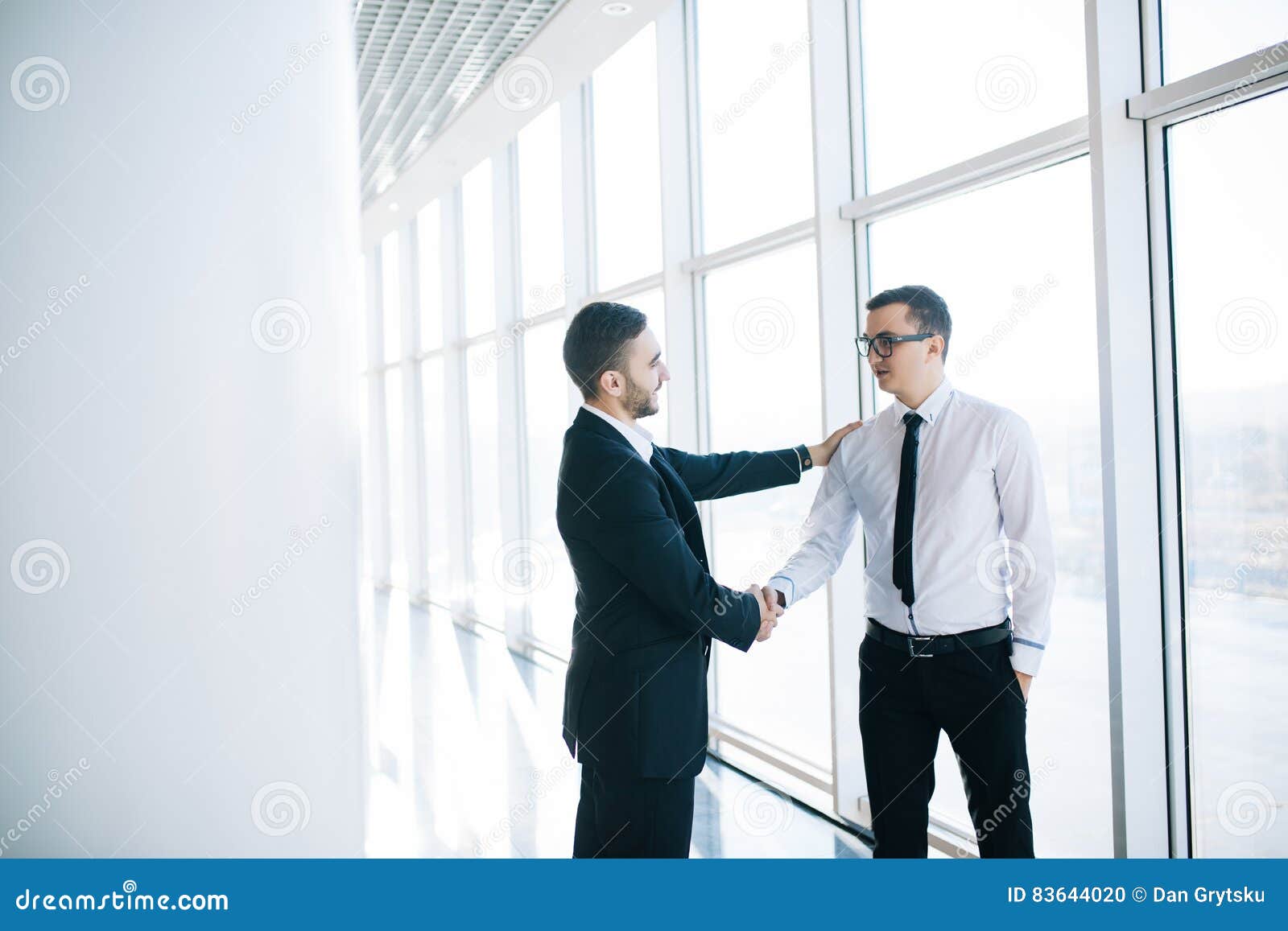 Two Business Men Shaking Hands in Office Stock Photo - Image of ...