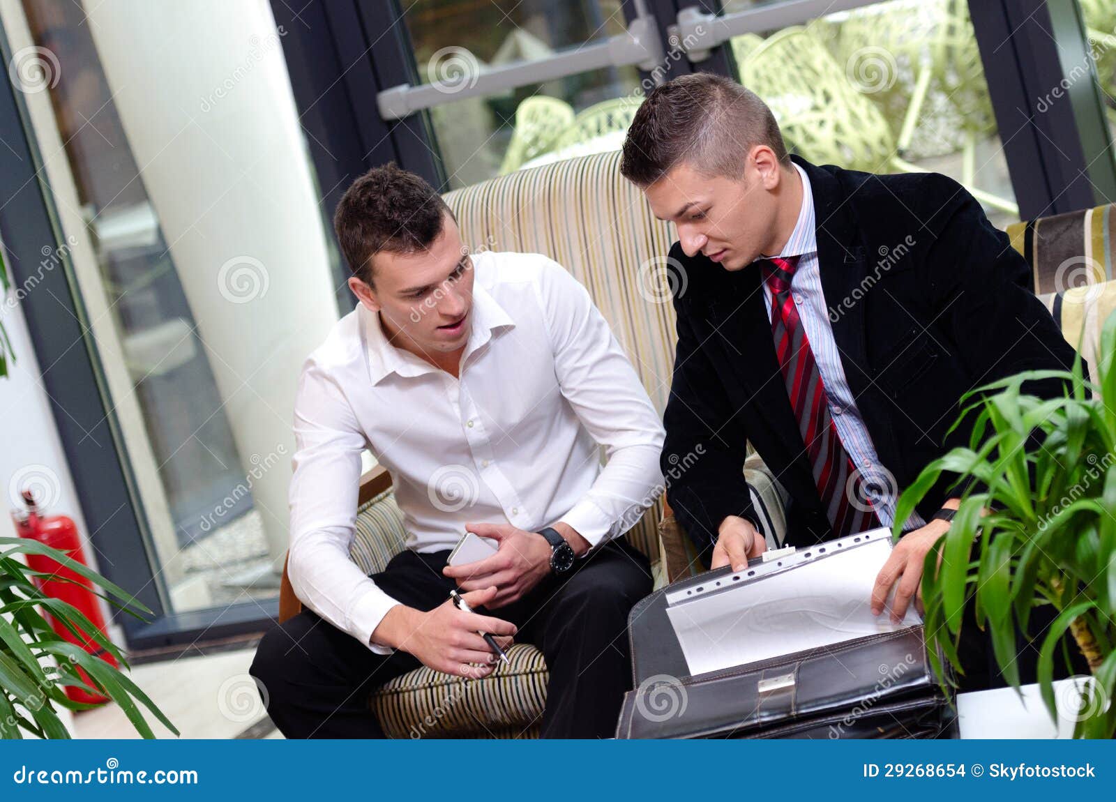 Two Business Men Talking about a Project Stock Photo - Image of ...