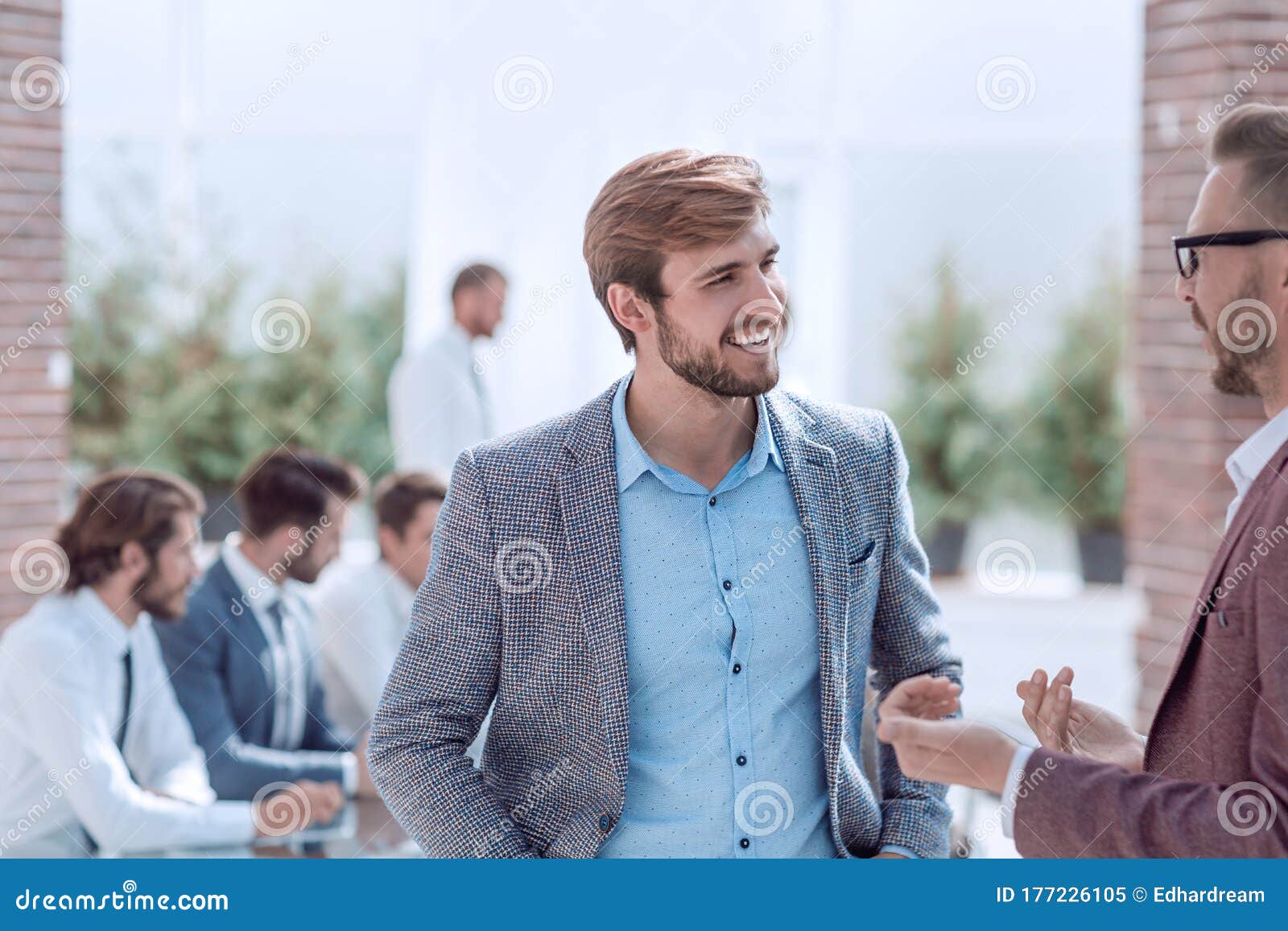 Two Business Men Talking Standing in the Office Stock Image - Image of ...