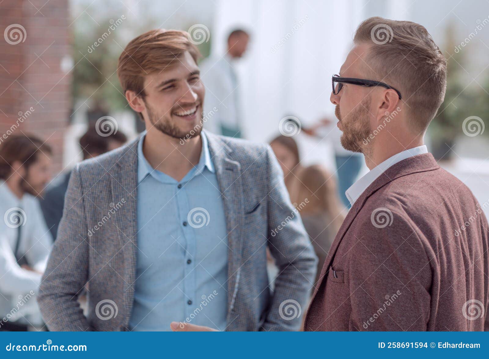 Two Business Men Talking Standing in the Office Stock Photo - Image of ...