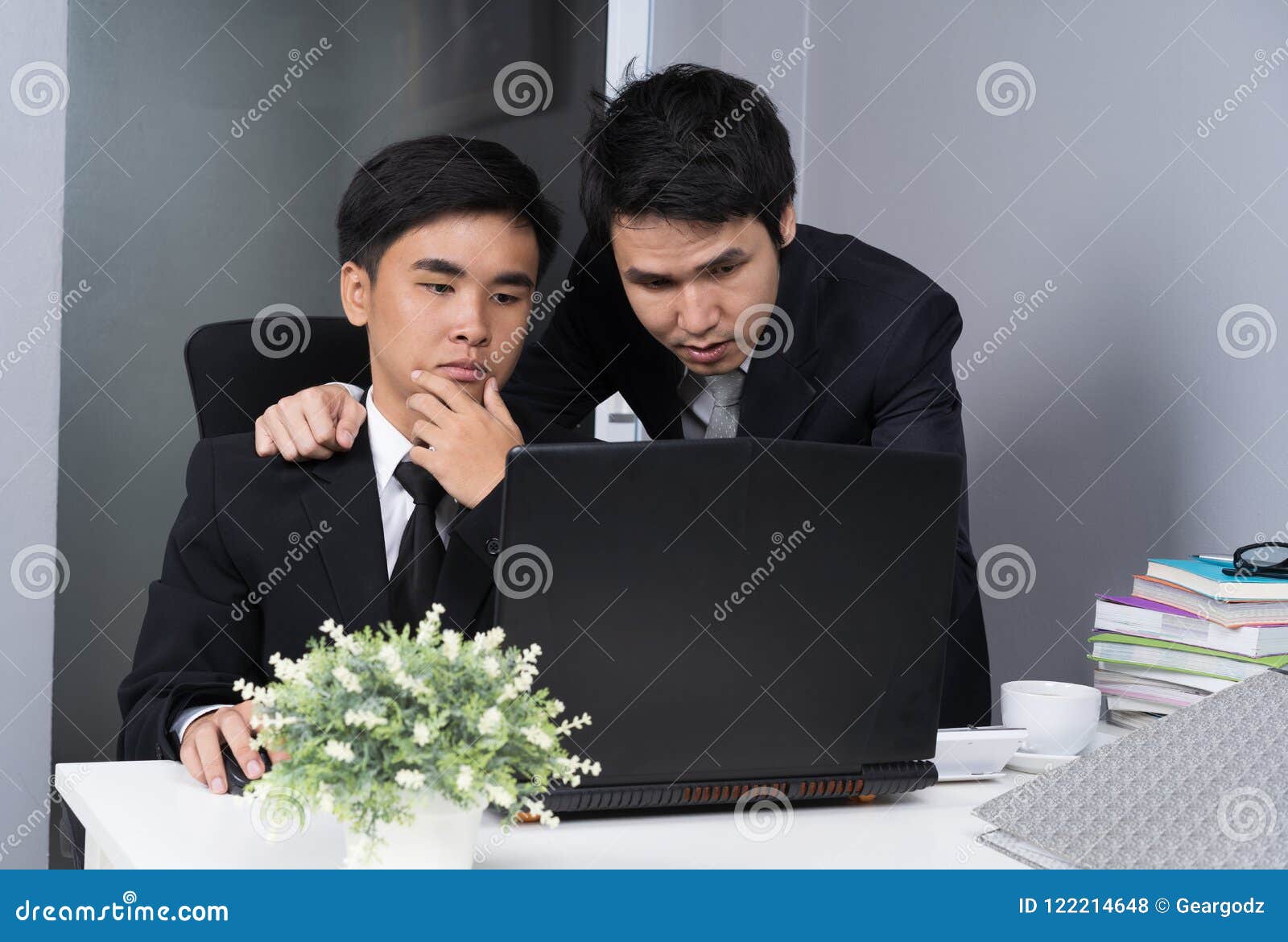 Two Business Man Using Laptop and Discussing Project Stock Photo ...