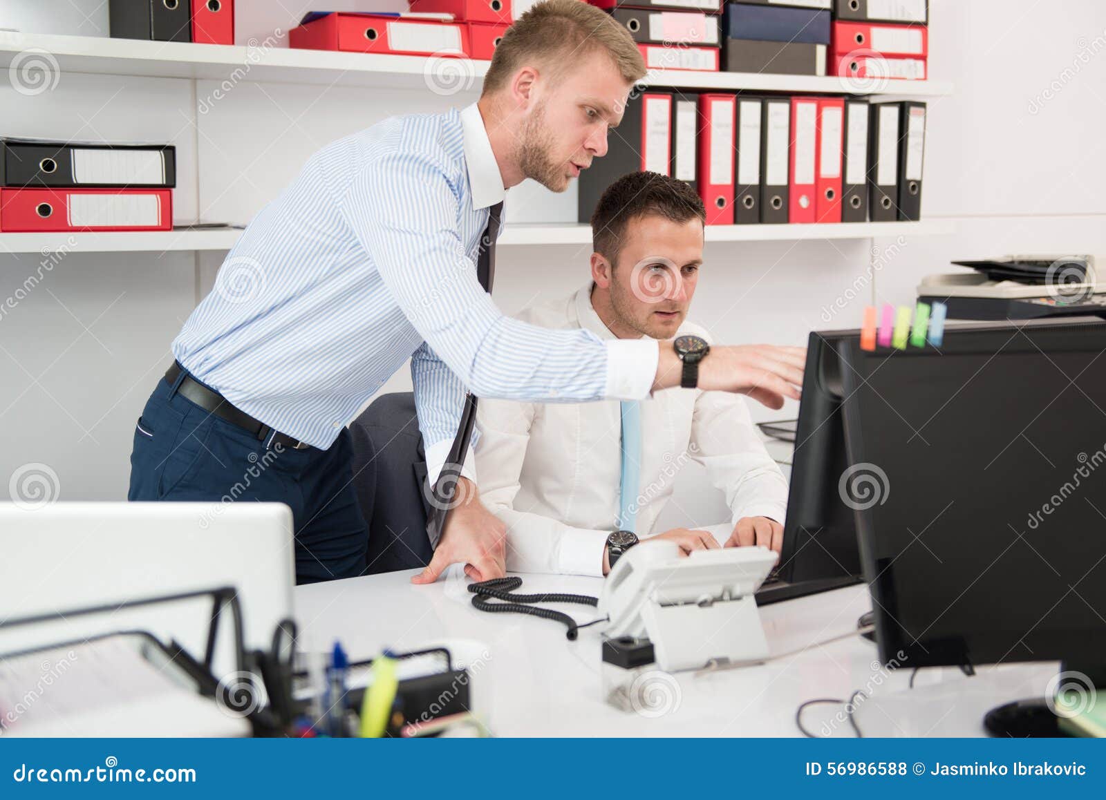 Two Business Men Working on a Computer Stock Photo - Image of looking ...