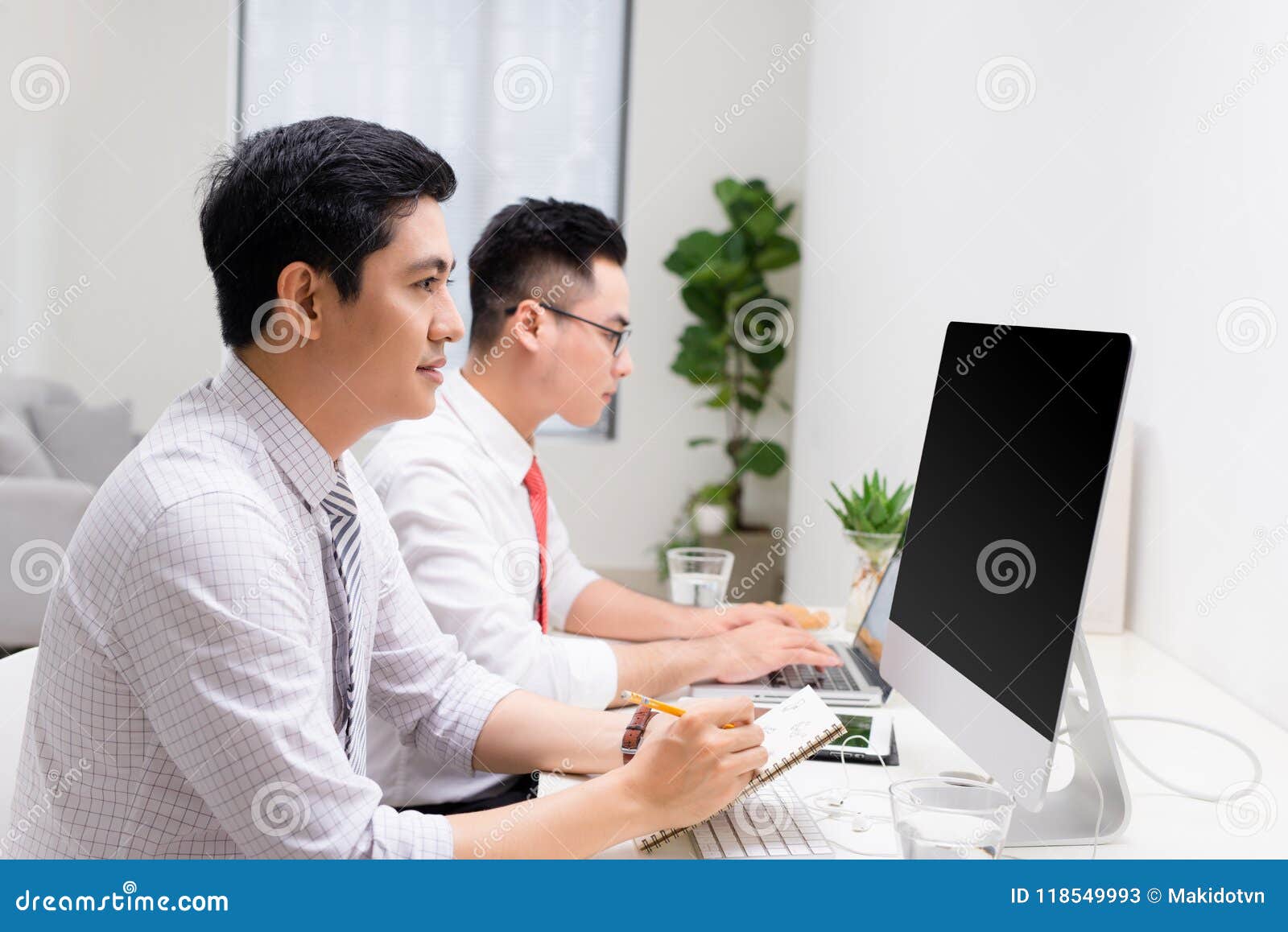 Two Business Men Working at Pc in Office Stock Image - Image of looking ...
