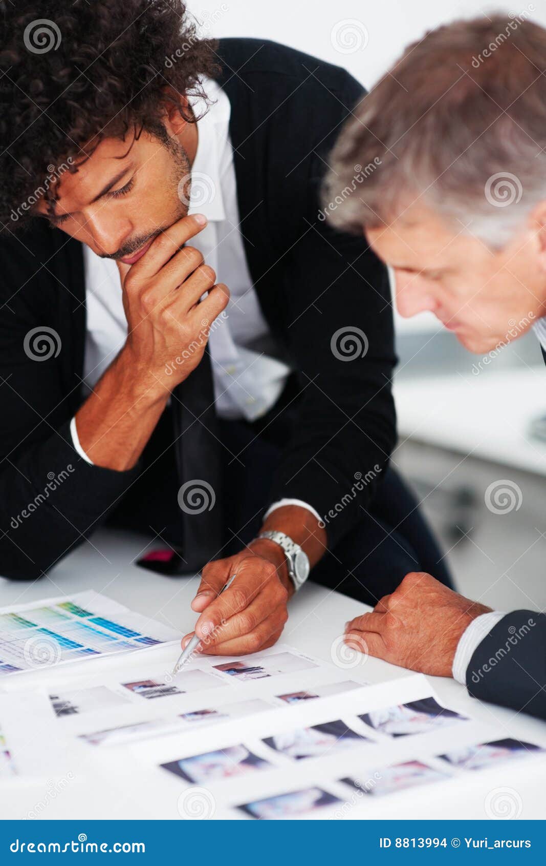 Two Business Men Working Together on a Paper Stock Photo - Image of ...