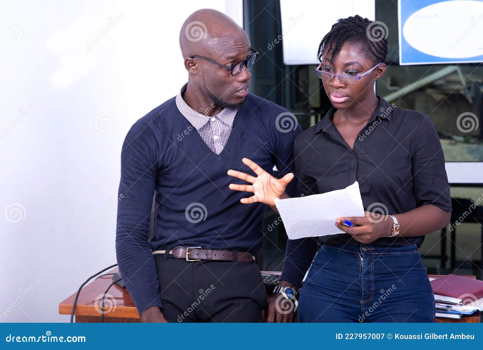 Two Business Partners Discussing Report Notes on Document in Office ...