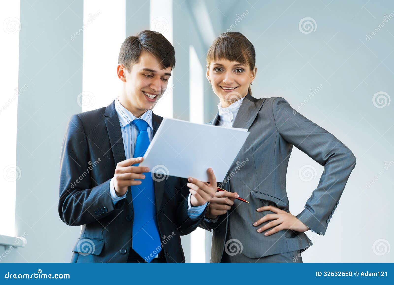 Two Business Partners Discussing Reports Stock Photo - Image of ...