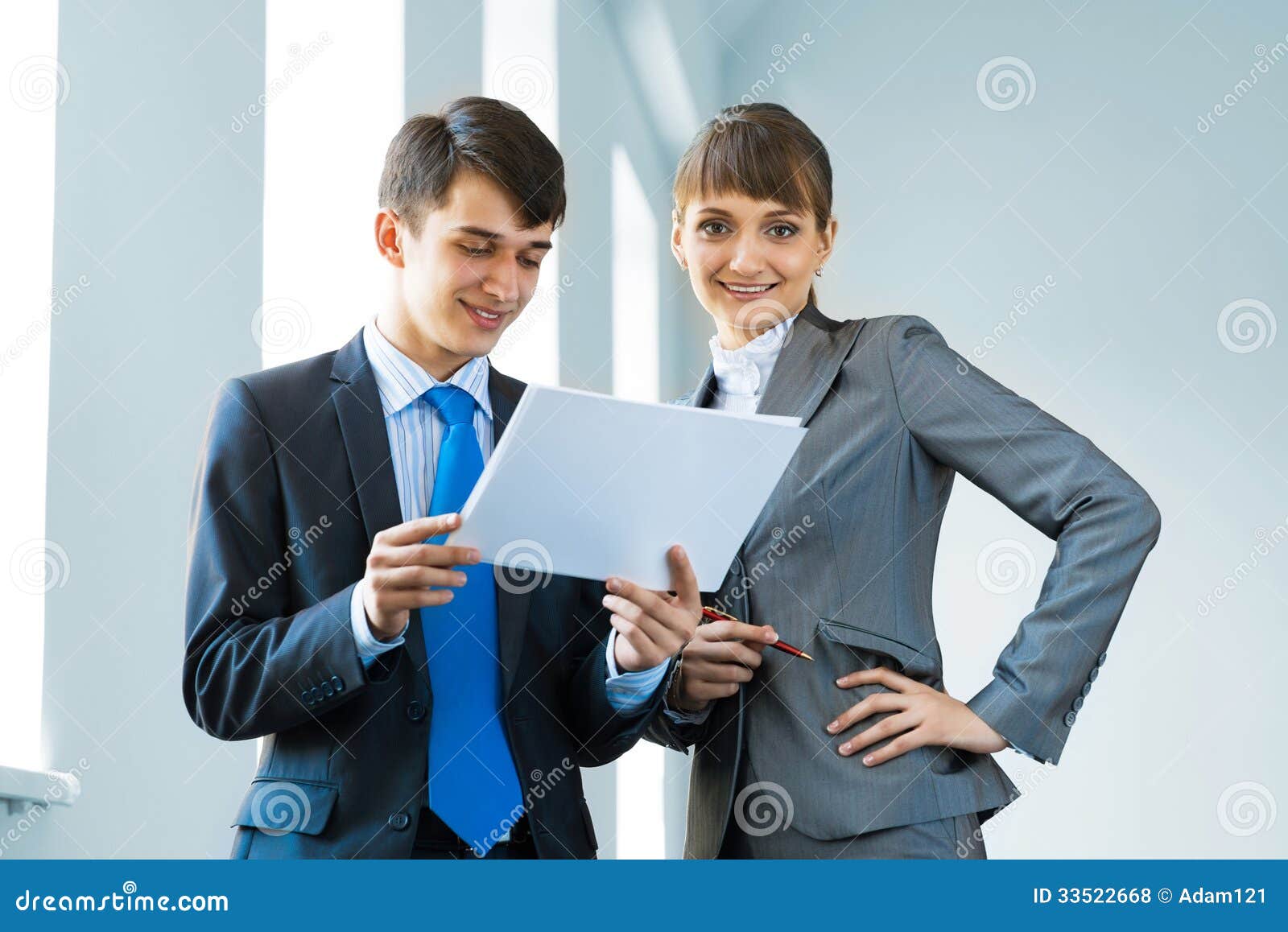 Two Business Partners Discussing Reports Stock Photo - Image of ...