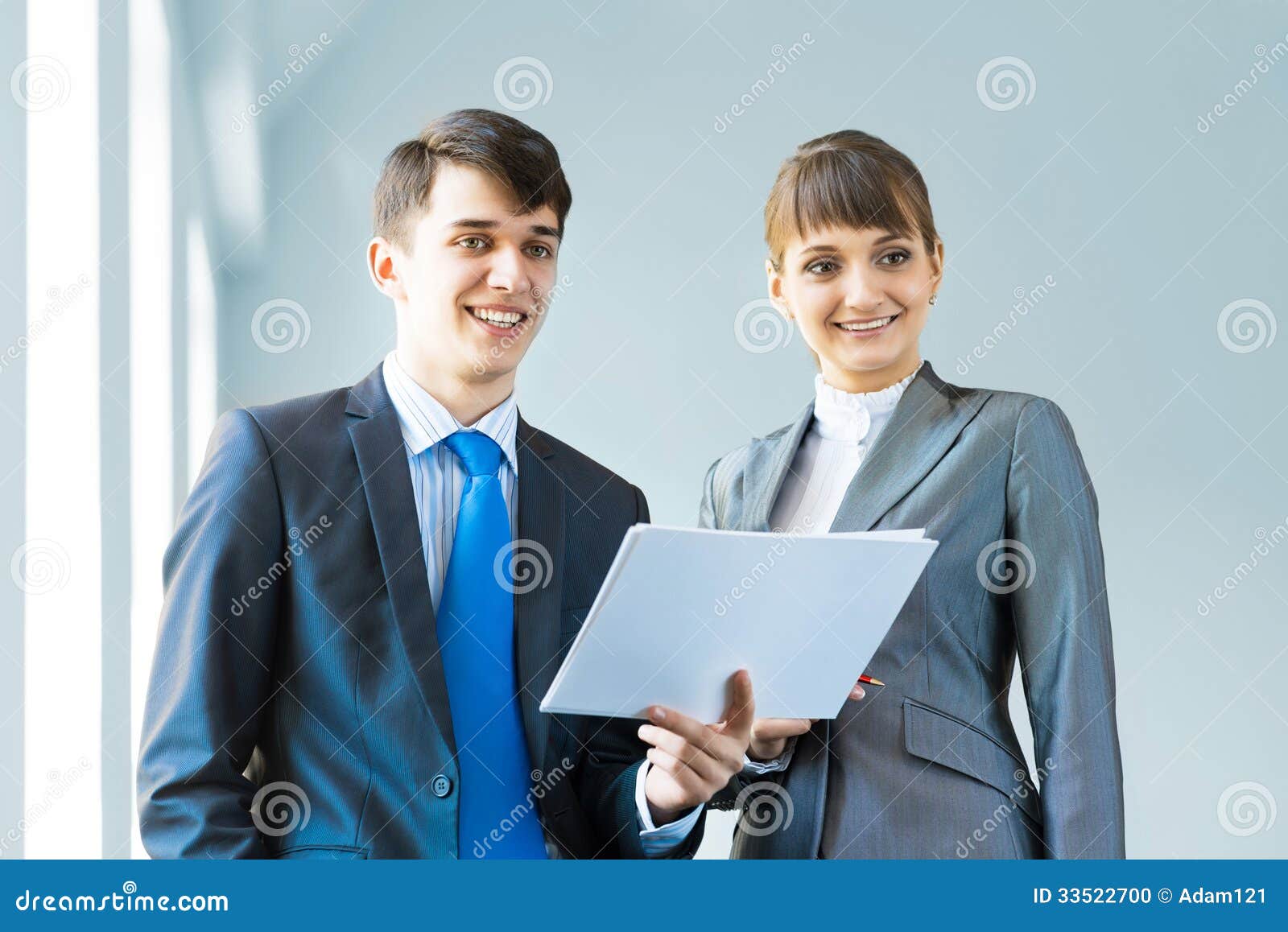 Two Business Partners Discussing Reports Stock Photo - Image of ...