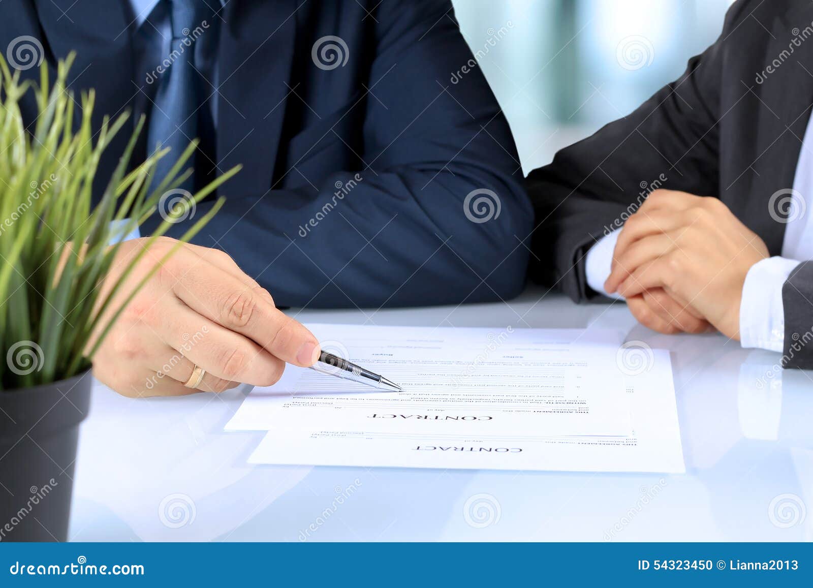 Two Business Partners Signing a Document Stock Photo - Image of ...