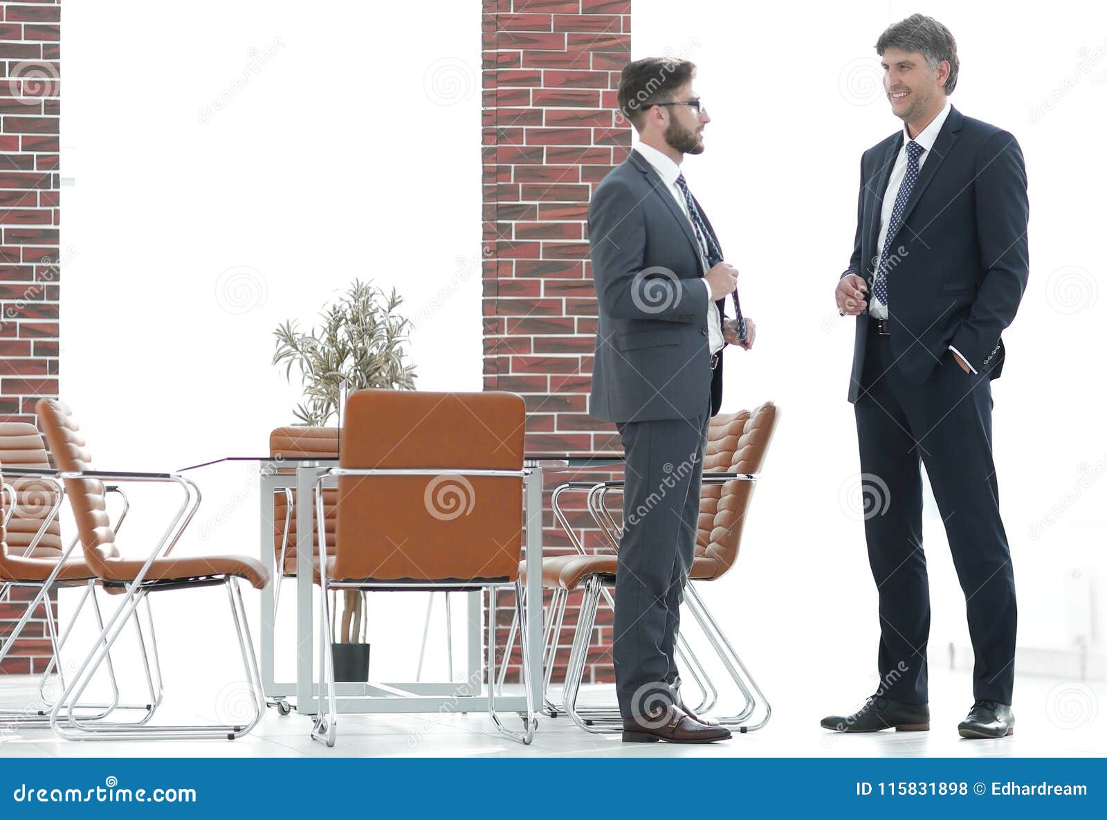 Two Business Executives Talking about Business in the Office. Stock ...