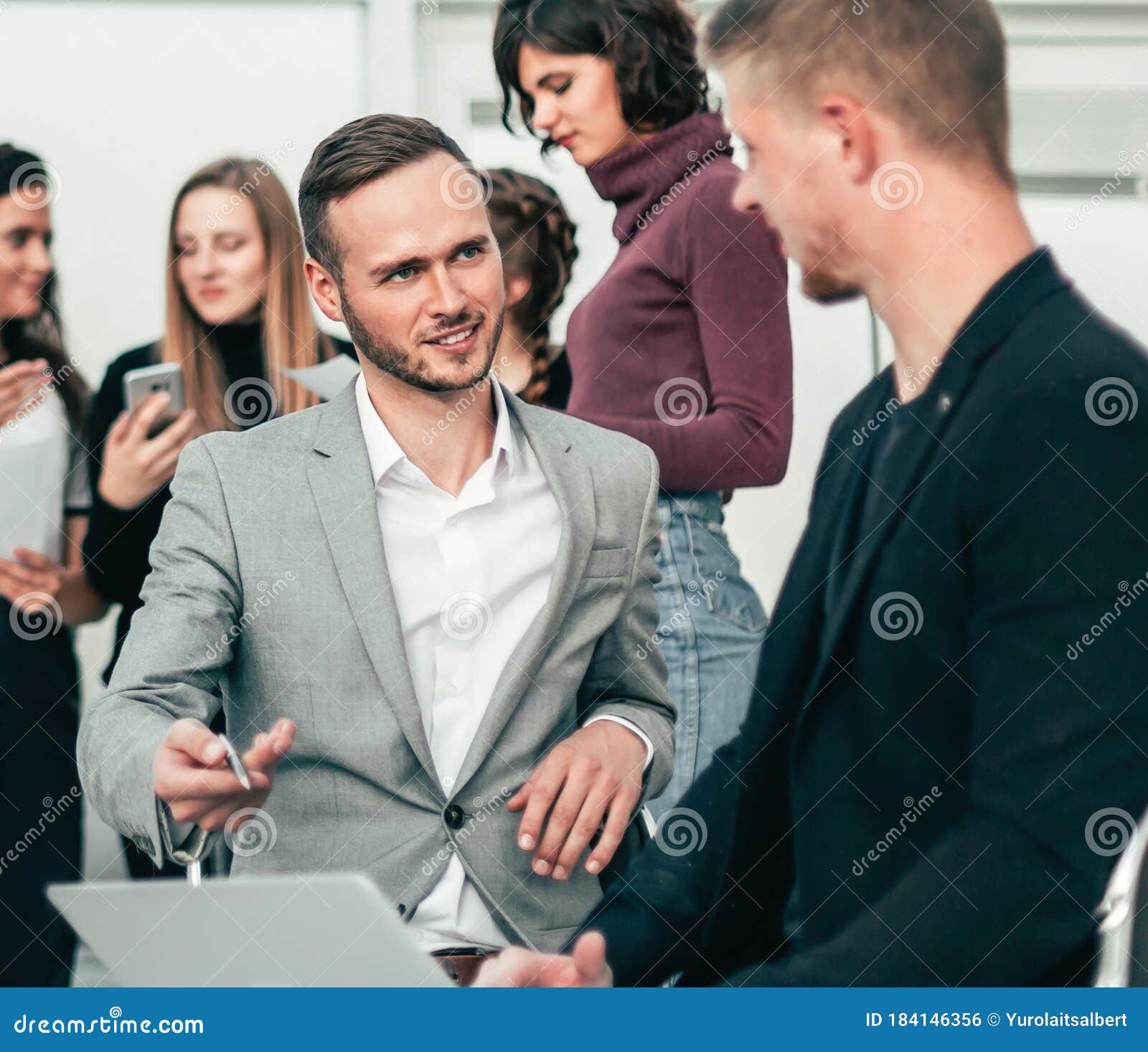 Two Business People Discussing Options for Solving a New Project Stock ...