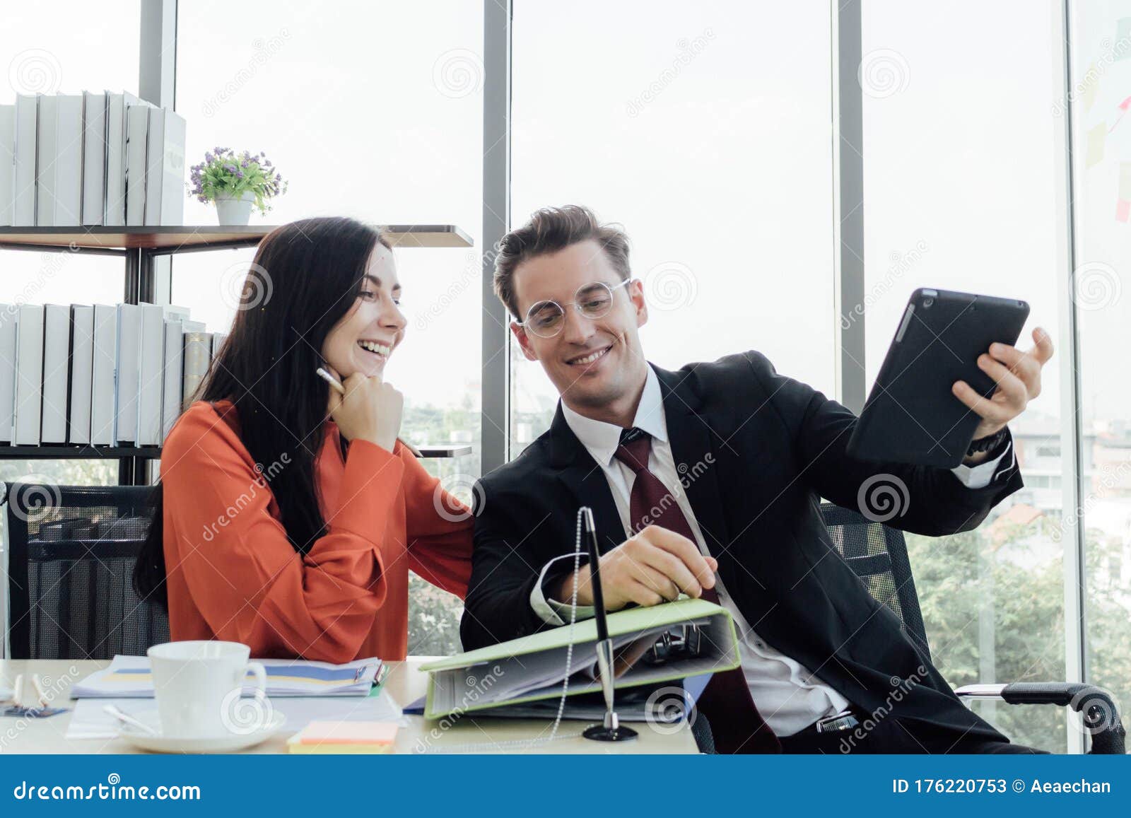 Two Business People Discussing about Work in an Office Stock Image ...