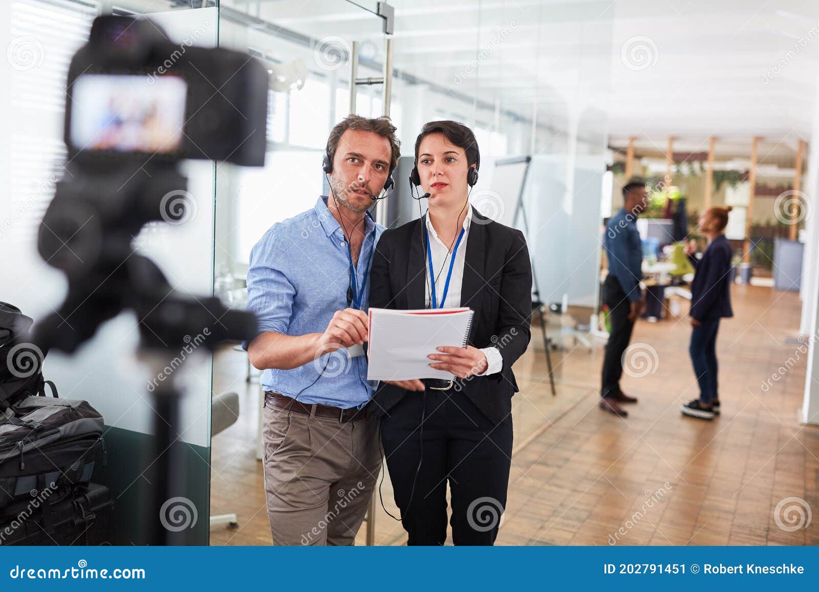 Two Business People in Front of the Video Camera Stock Image - Image of ...