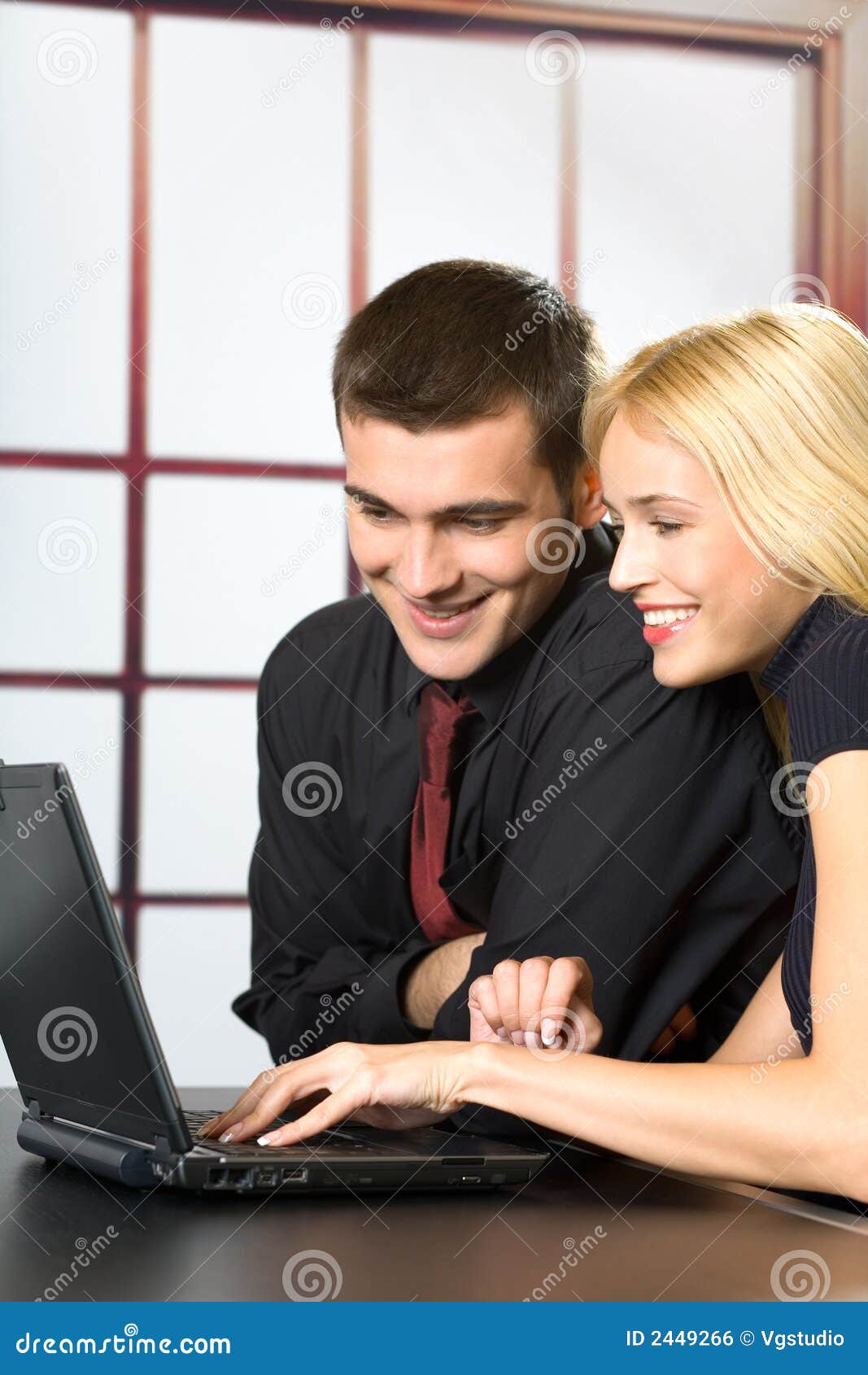 Two Business People on Laptop Stock Photo - Image of happy, blond: 2449266