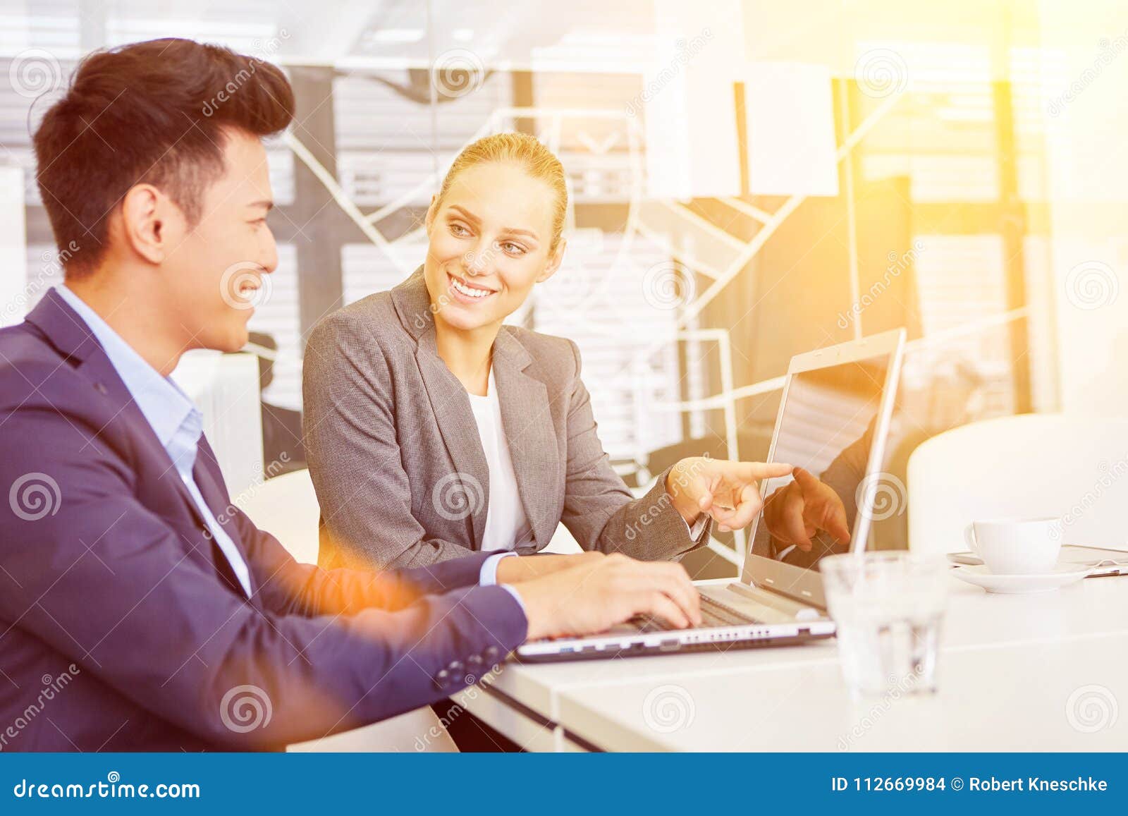 Two Business People with Laptop Computer Stock Photo - Image of ...