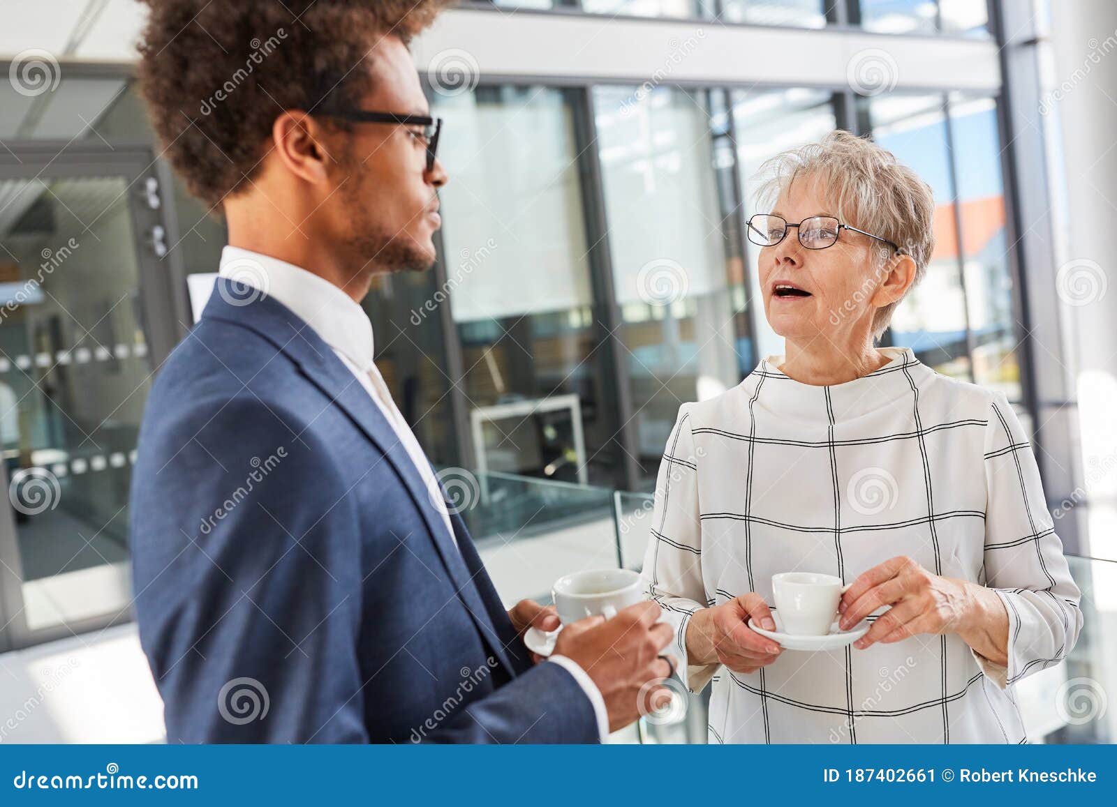 Two Business People Make Small Talk in the Office Stock Image - Image ...