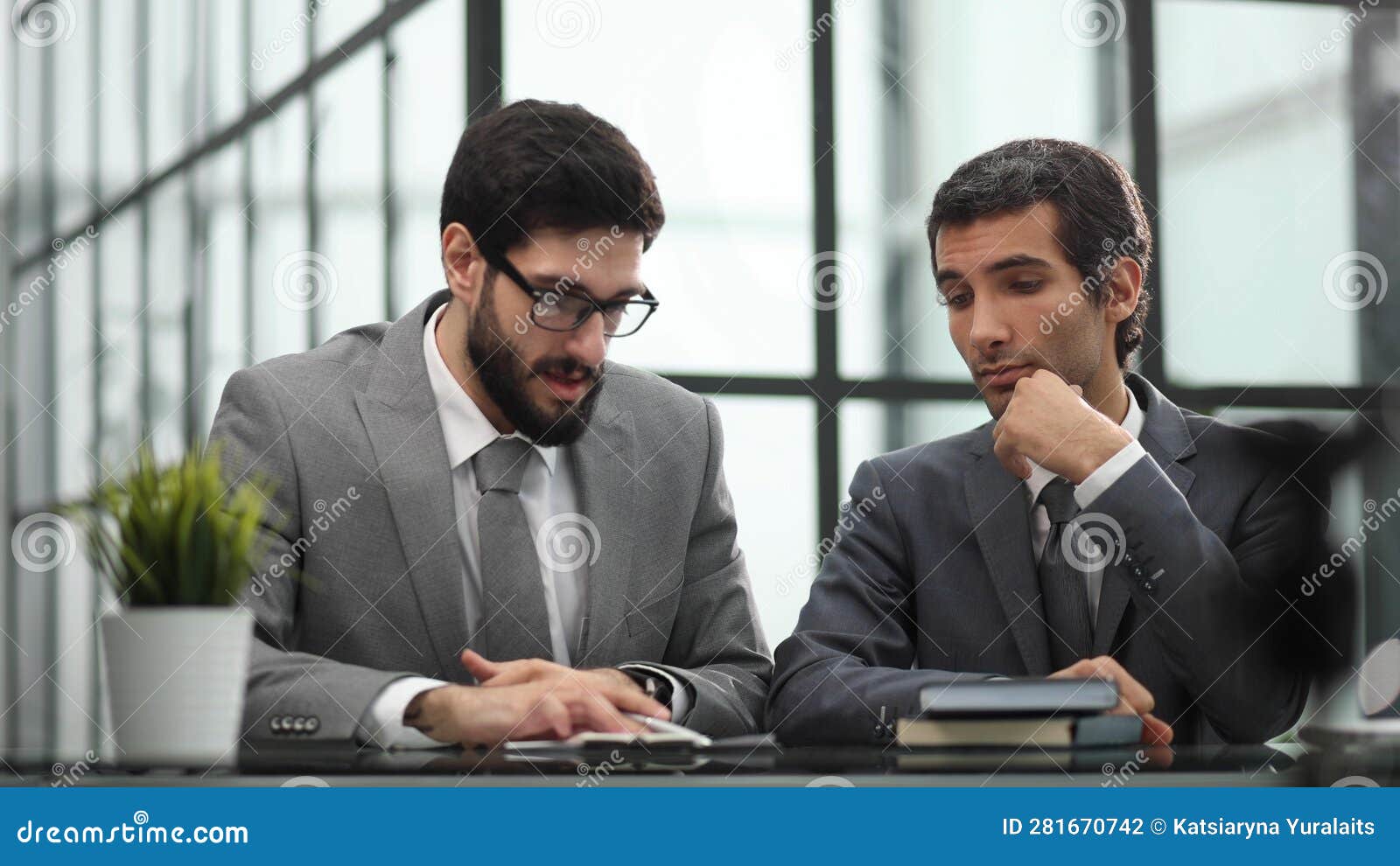 Two Business People in the Office at the Table Stock Photo - Image of ...