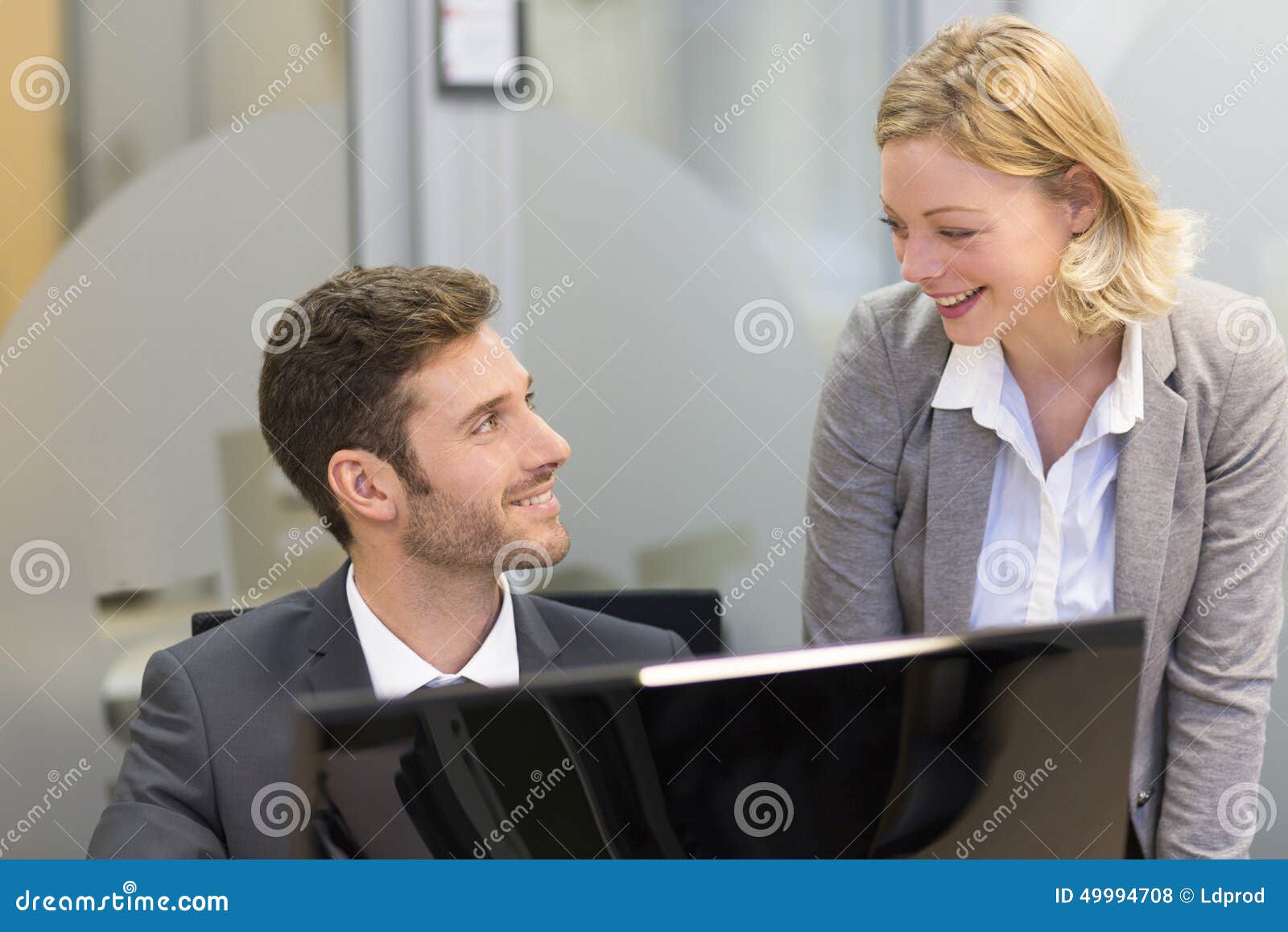 Two Business People in a Office, Working on Computer Stock Photo ...