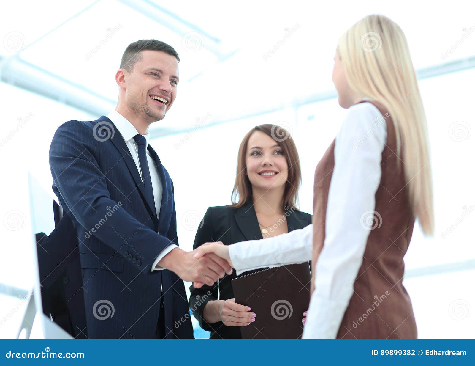 Two Business People Shaking Hands with Each Other in the Office Stock ...